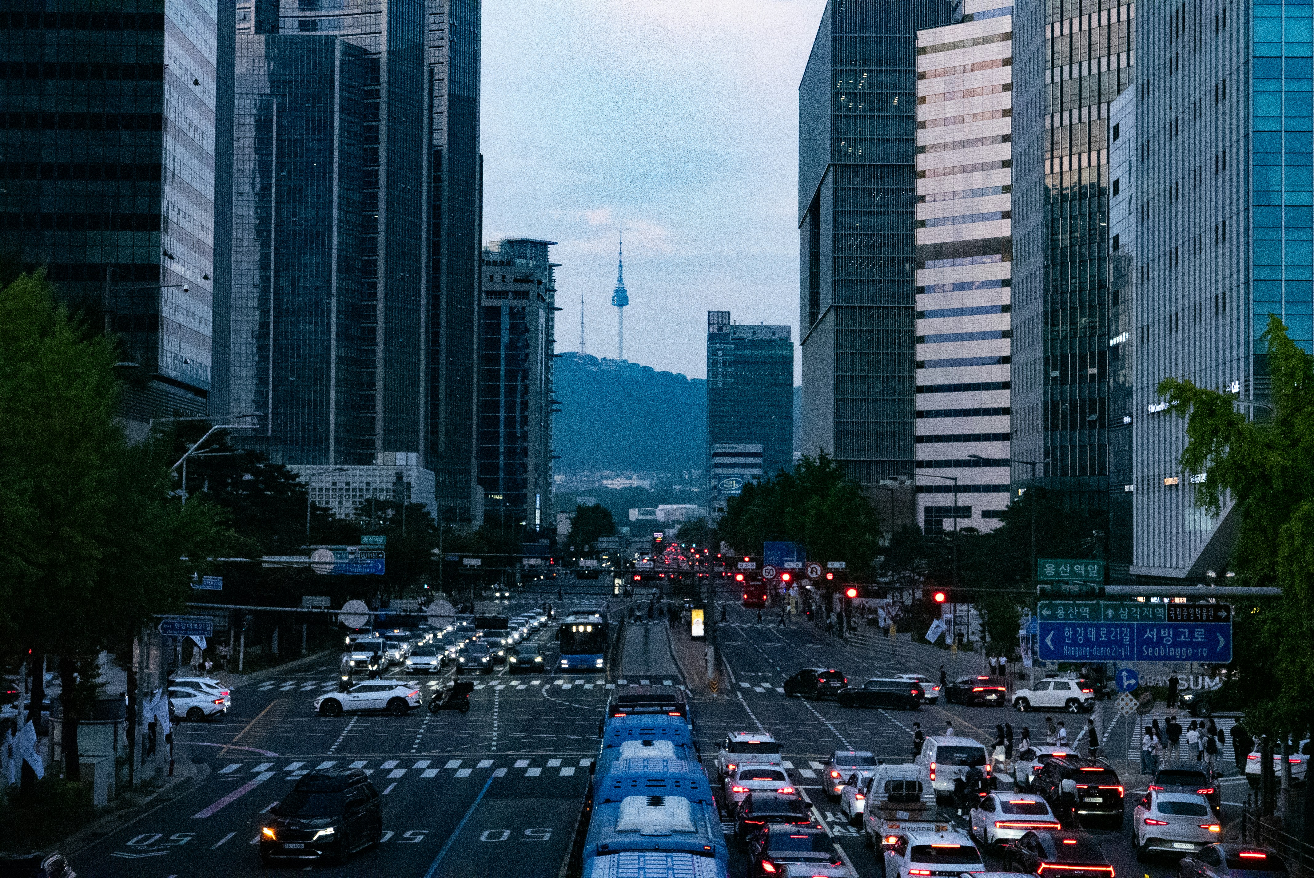 Cityway Convergence: A Busier Crossroads Under a Distant Skyline