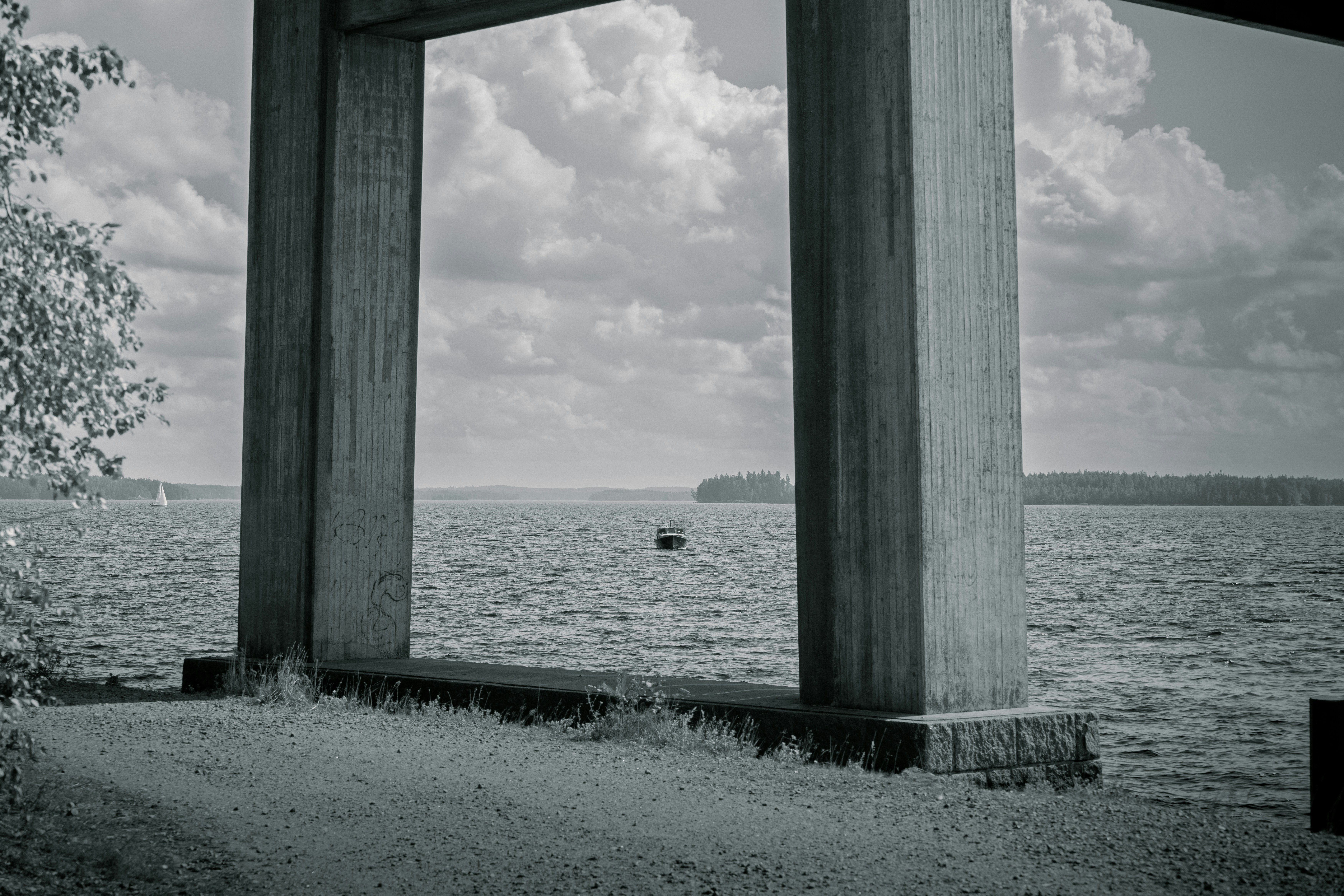Concrete Pier Frames the Quiet Sea Under a Clouded Sky