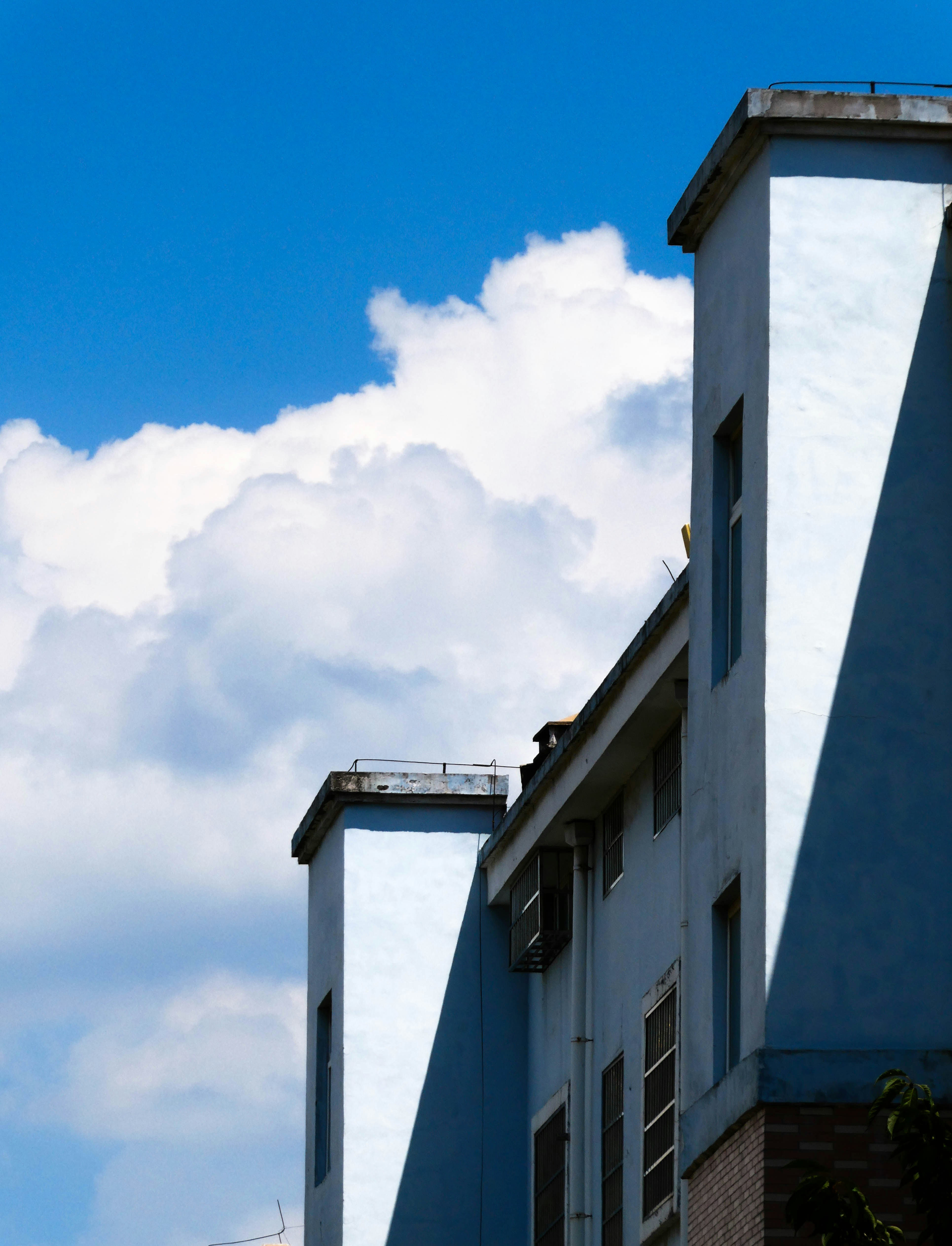 Blue Facade and Tall Shadowed Edge