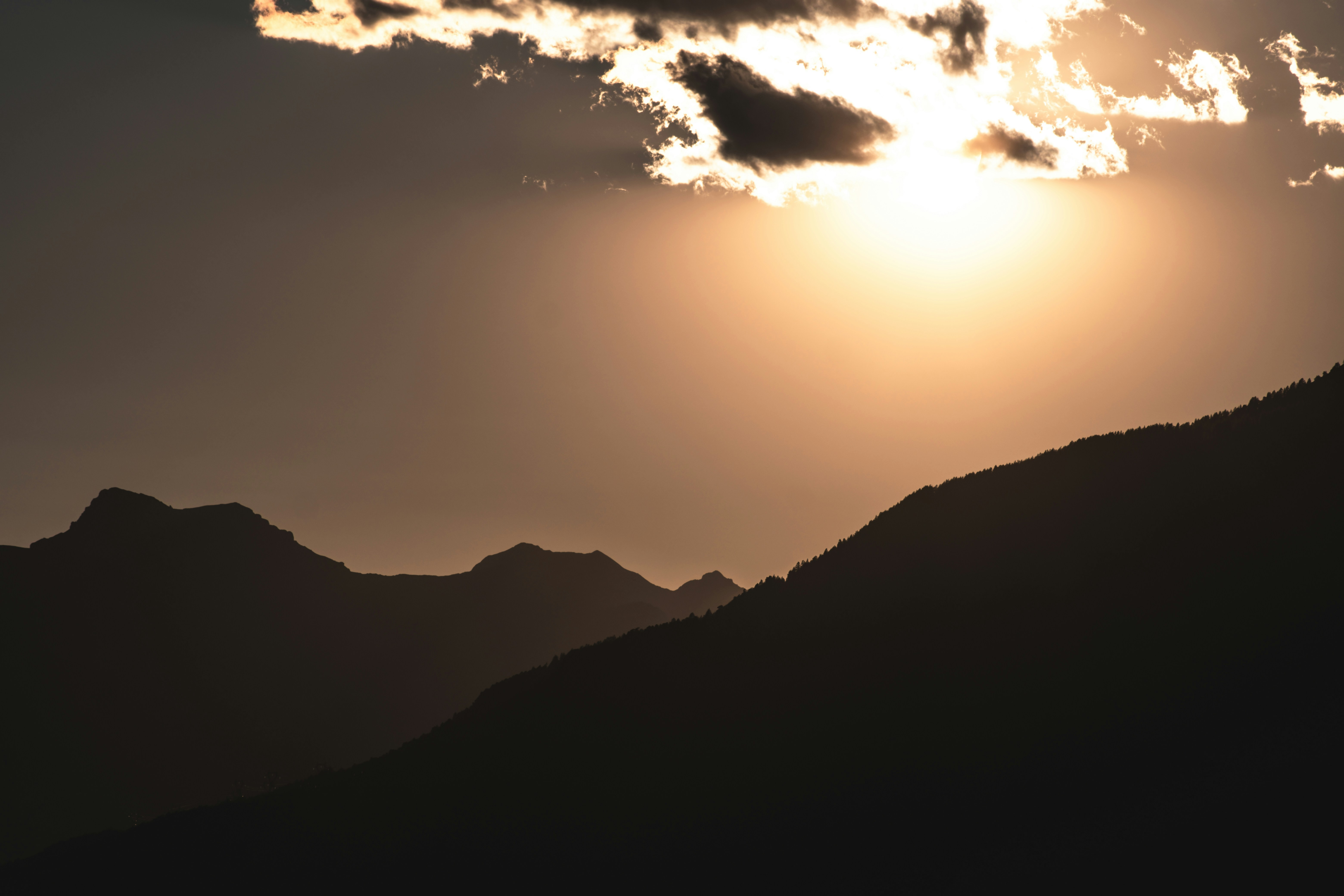 Sunlit Ridge Over Silent Valleys at Dusk