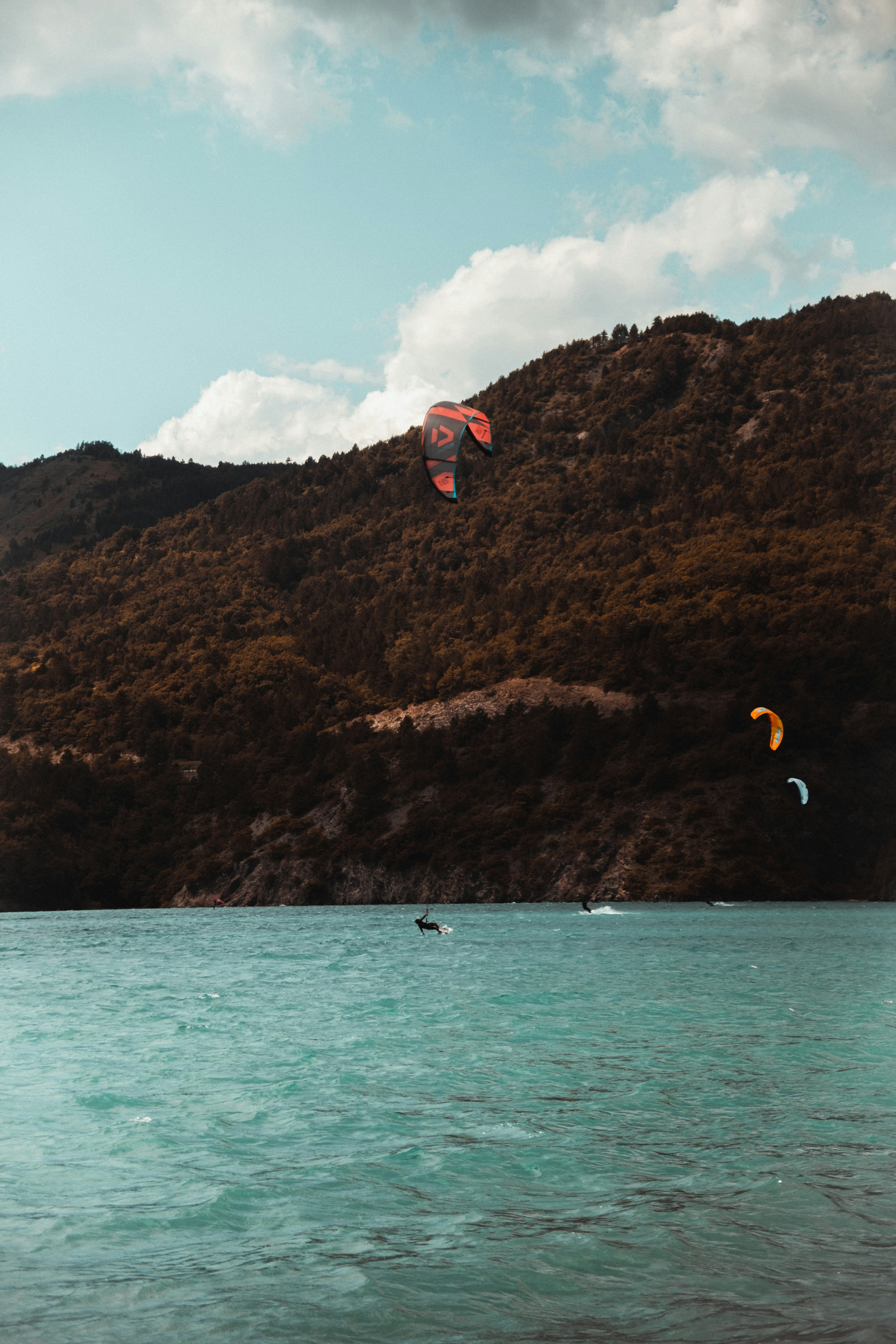 Kite Surfers Above Turquoise Waters and a Sheltered Cove