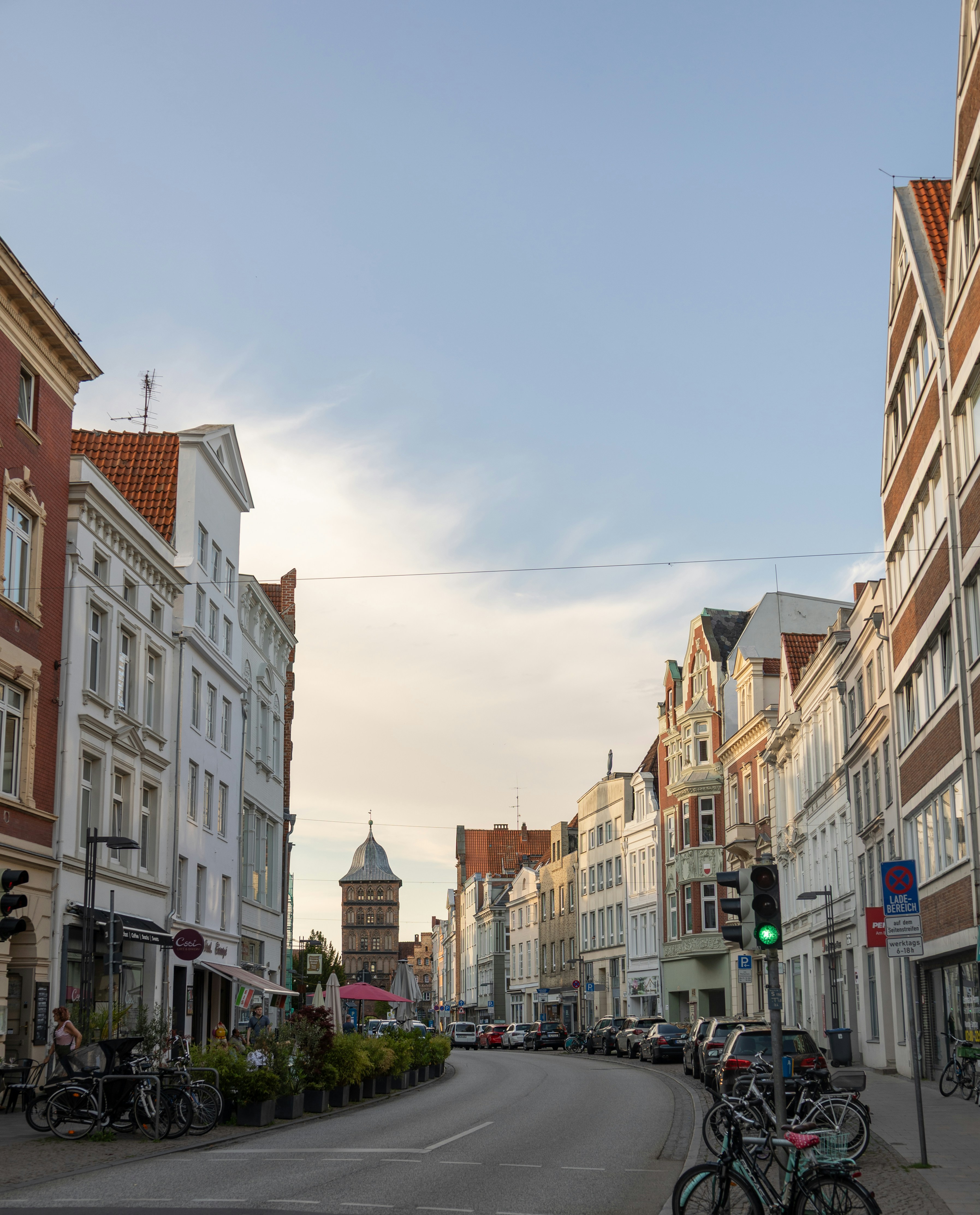 Sunlit Dutch Street Aflame with Historic Facades