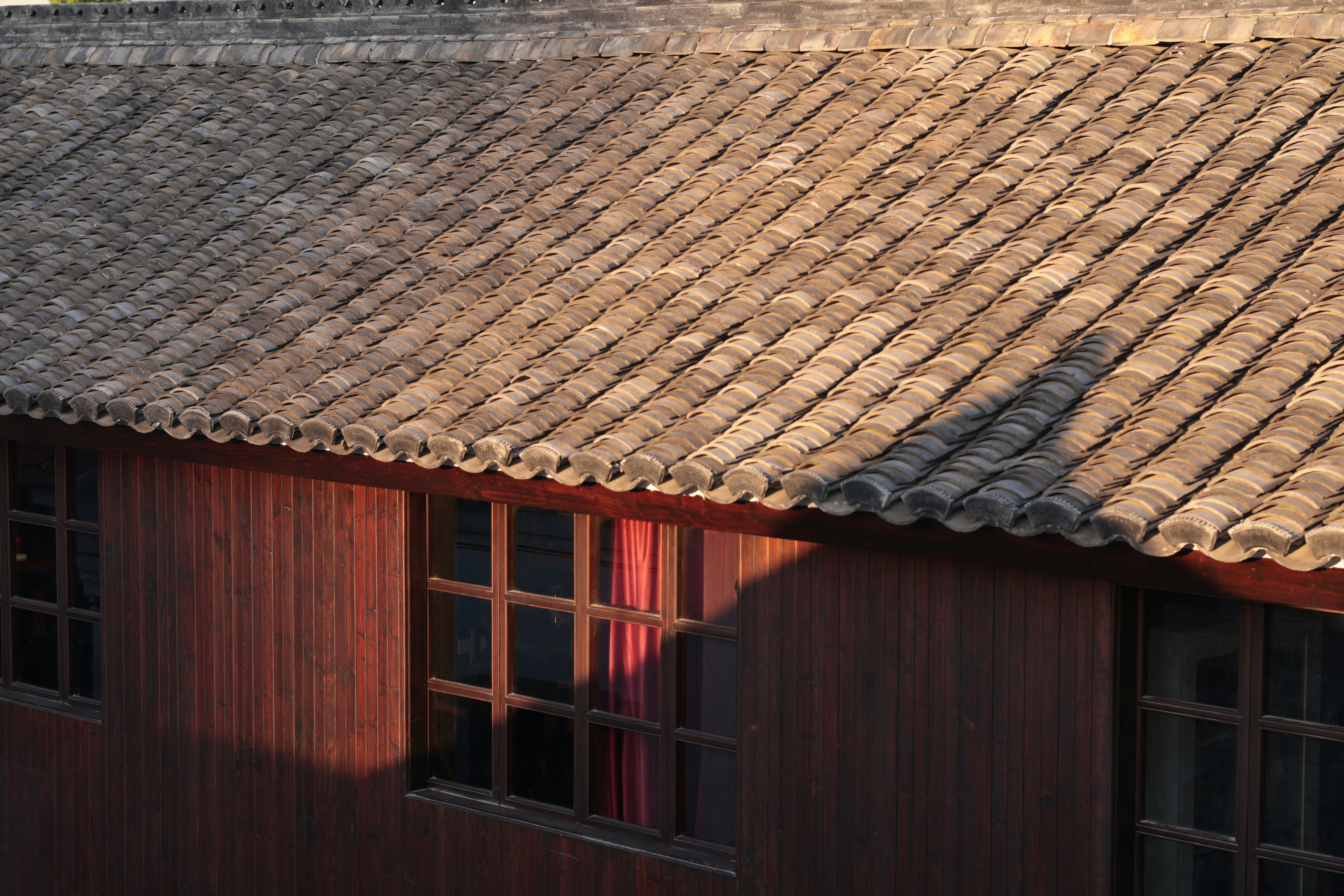 The Red-Wood Window Under Folded Tiles