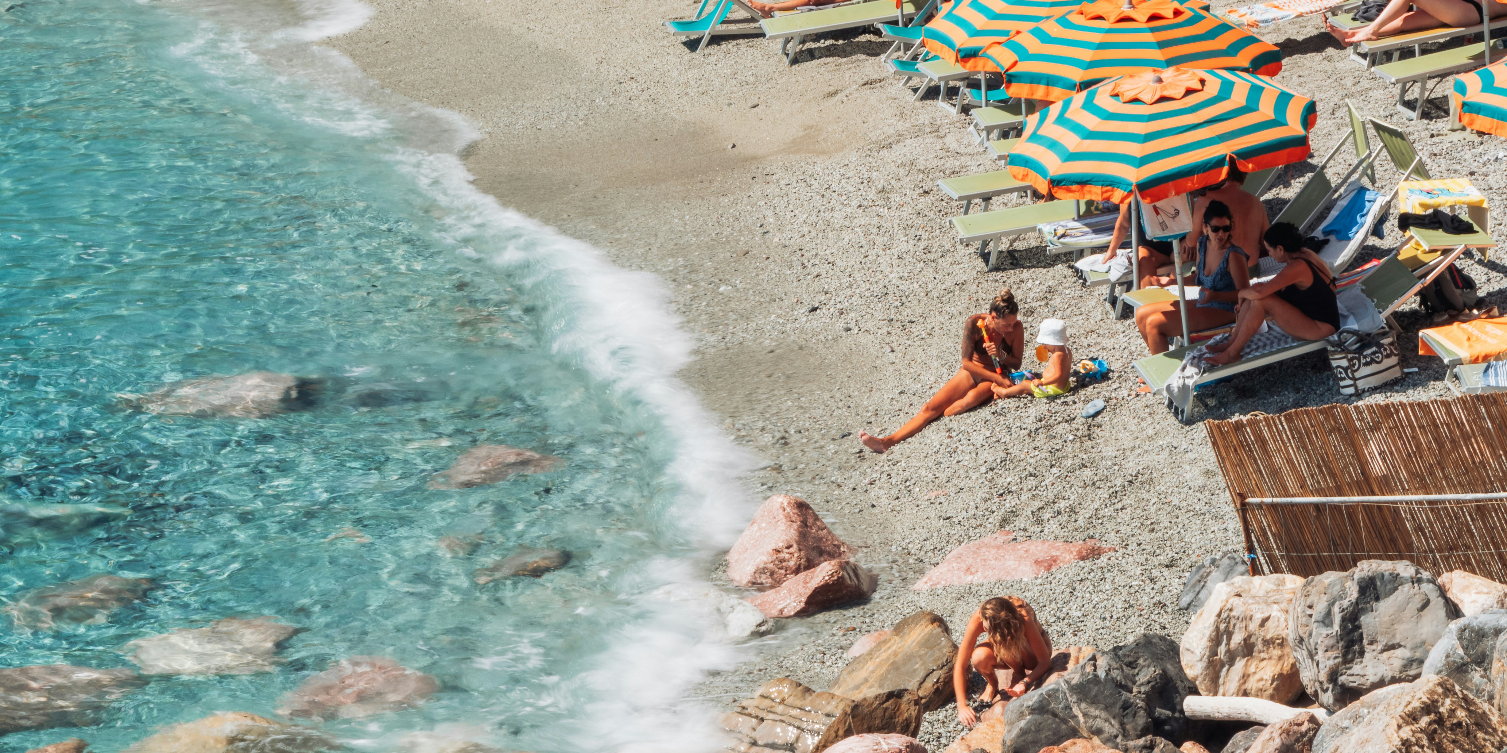Sunlit Riviera: Striped Canopies and Sea-foam Memories