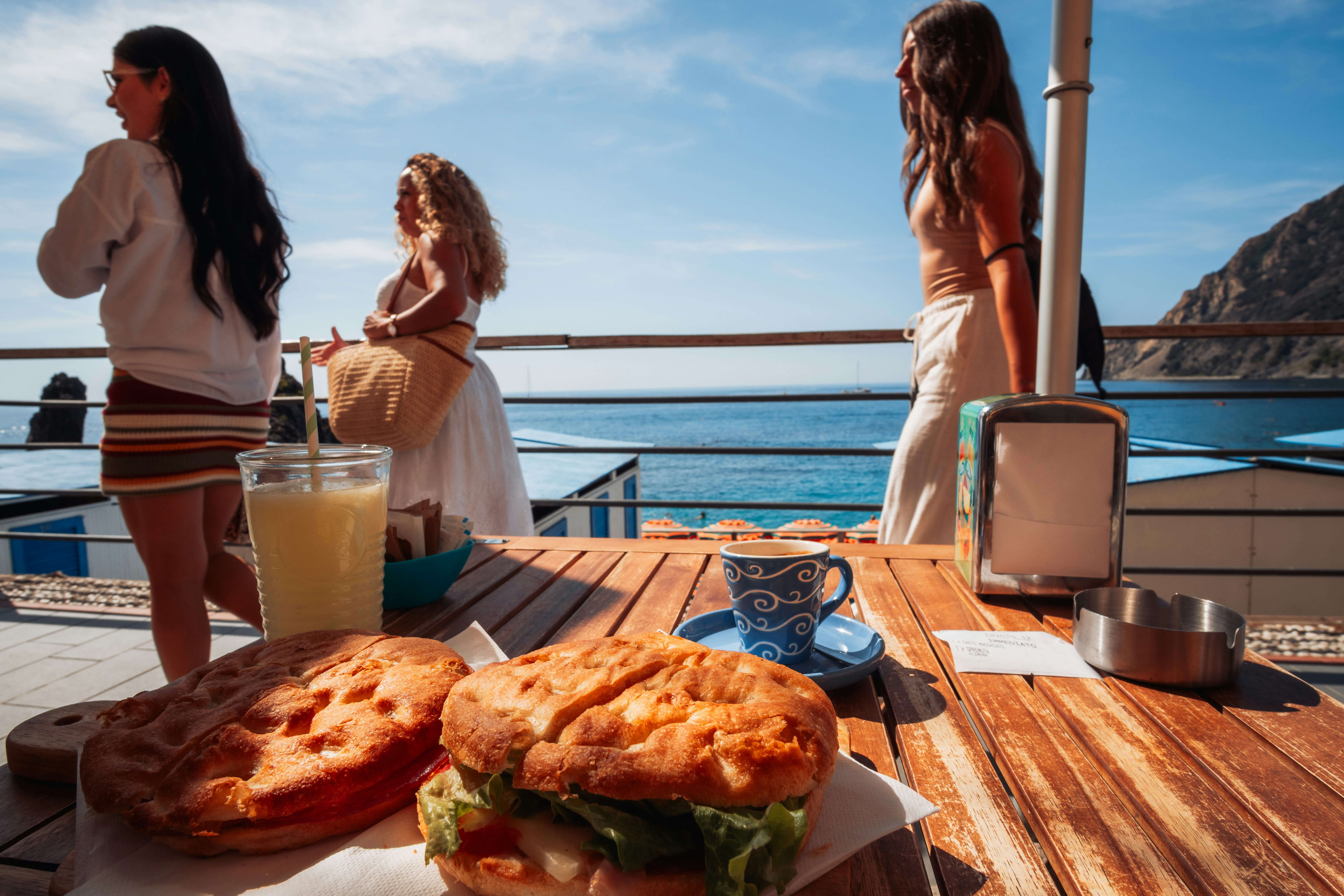 Sunlit Terrace Feast: A Coastal Café Moment