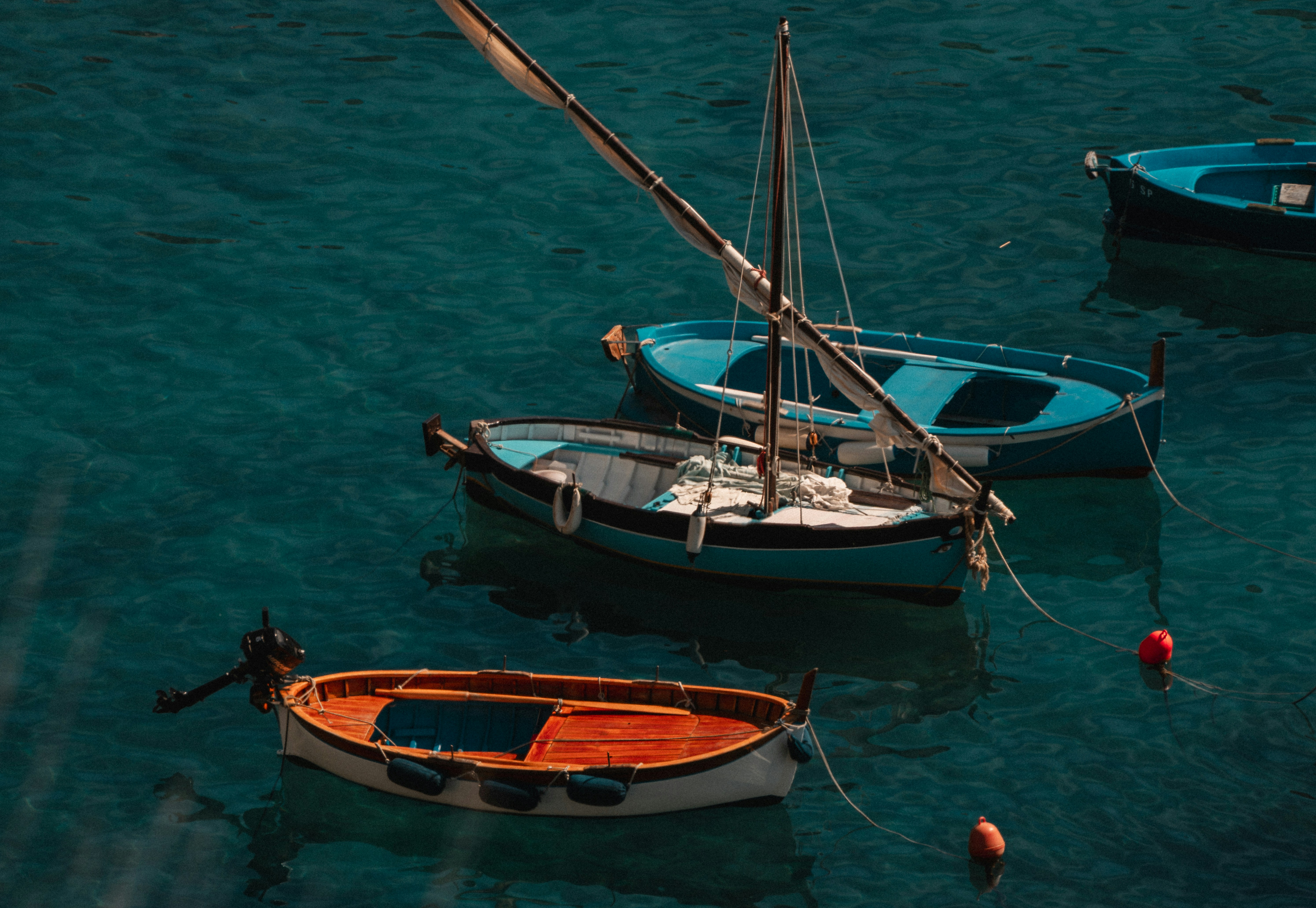 Azure Boats Resting in Quiet Sea