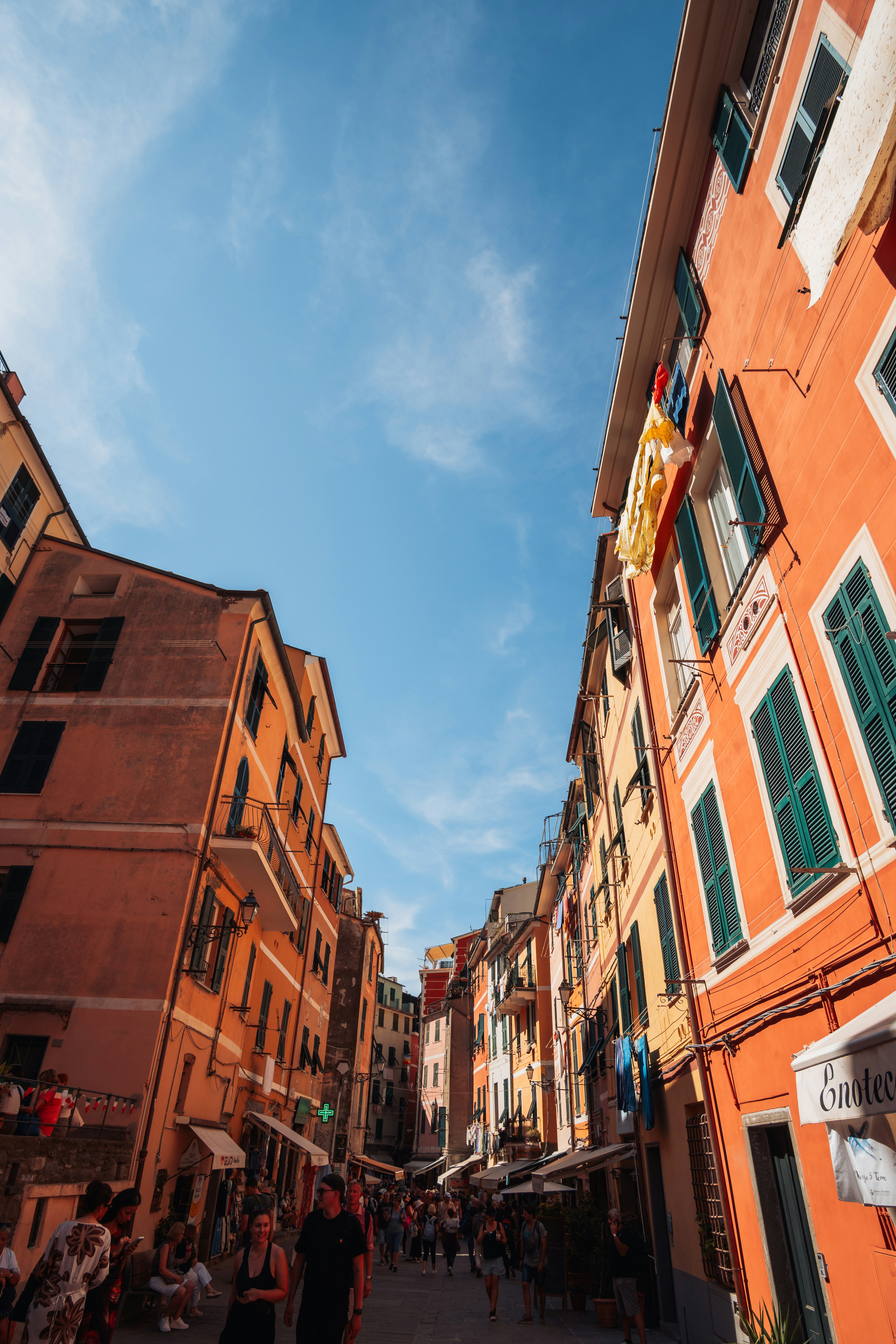 Sunlit Calle: Colors of a Coastal Italian Street