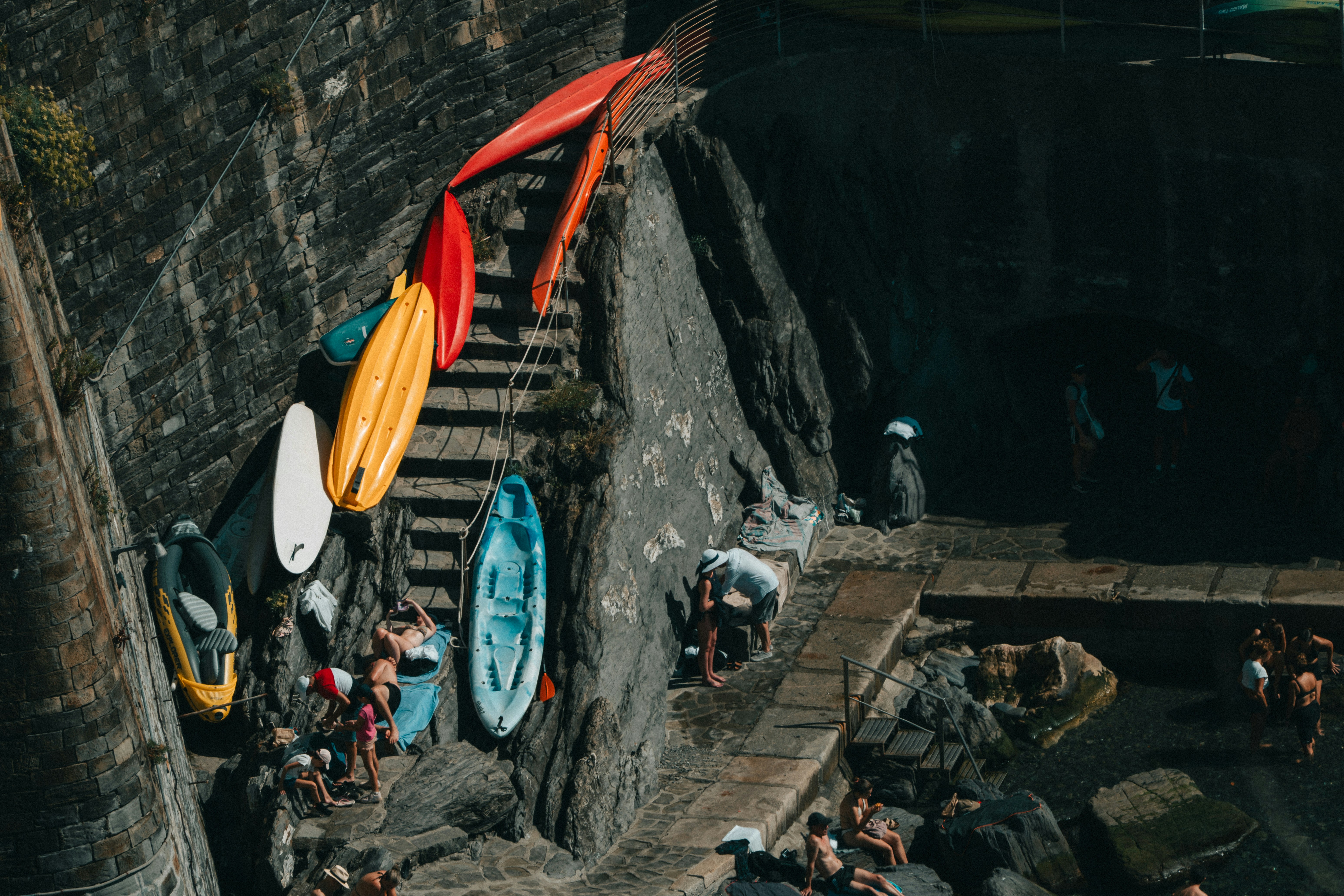 Harbor of Color: Kayaks and Climbers at the Sea Gate