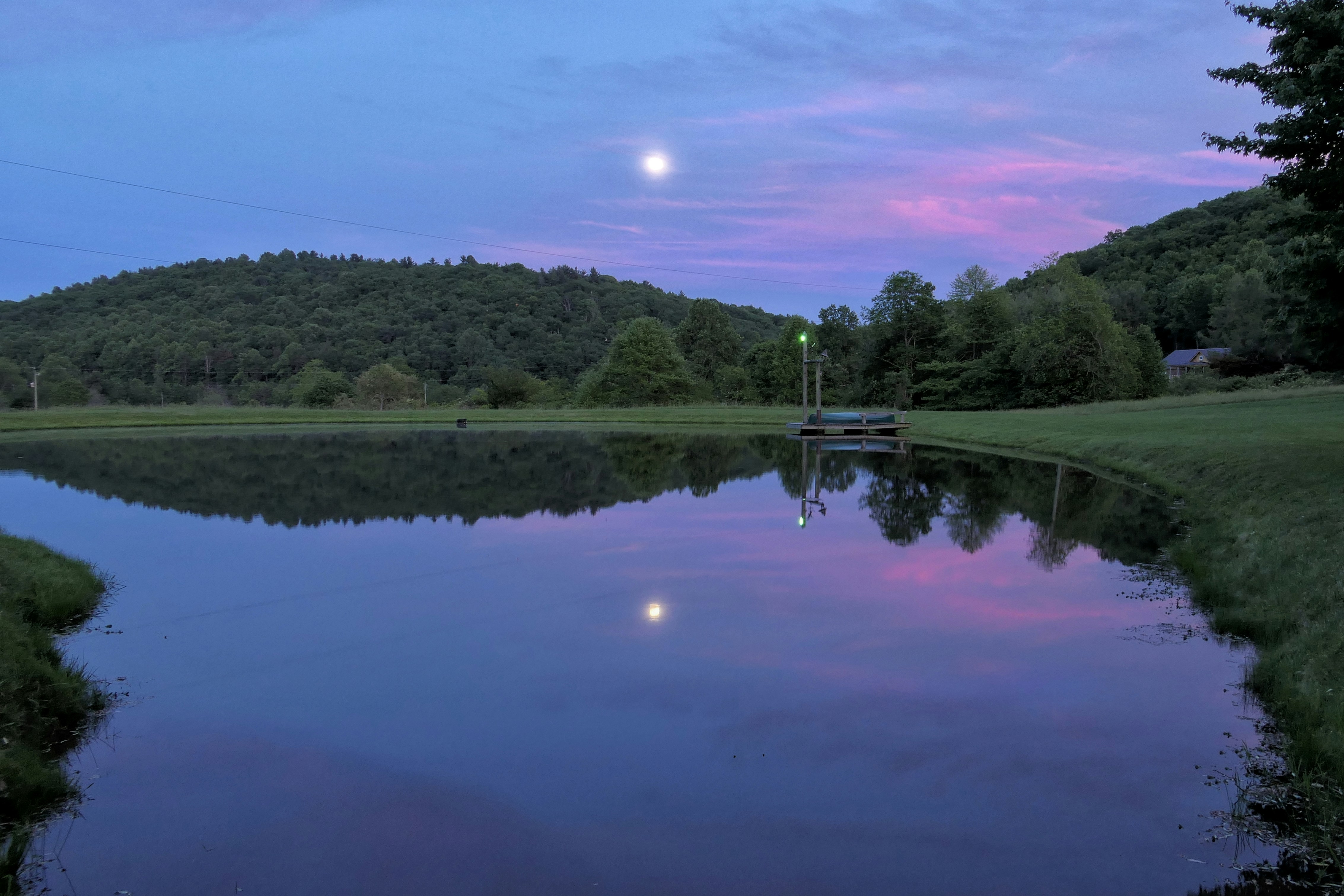 Moonlit Pond at Dusk: Reflections Across a Quiet Glen