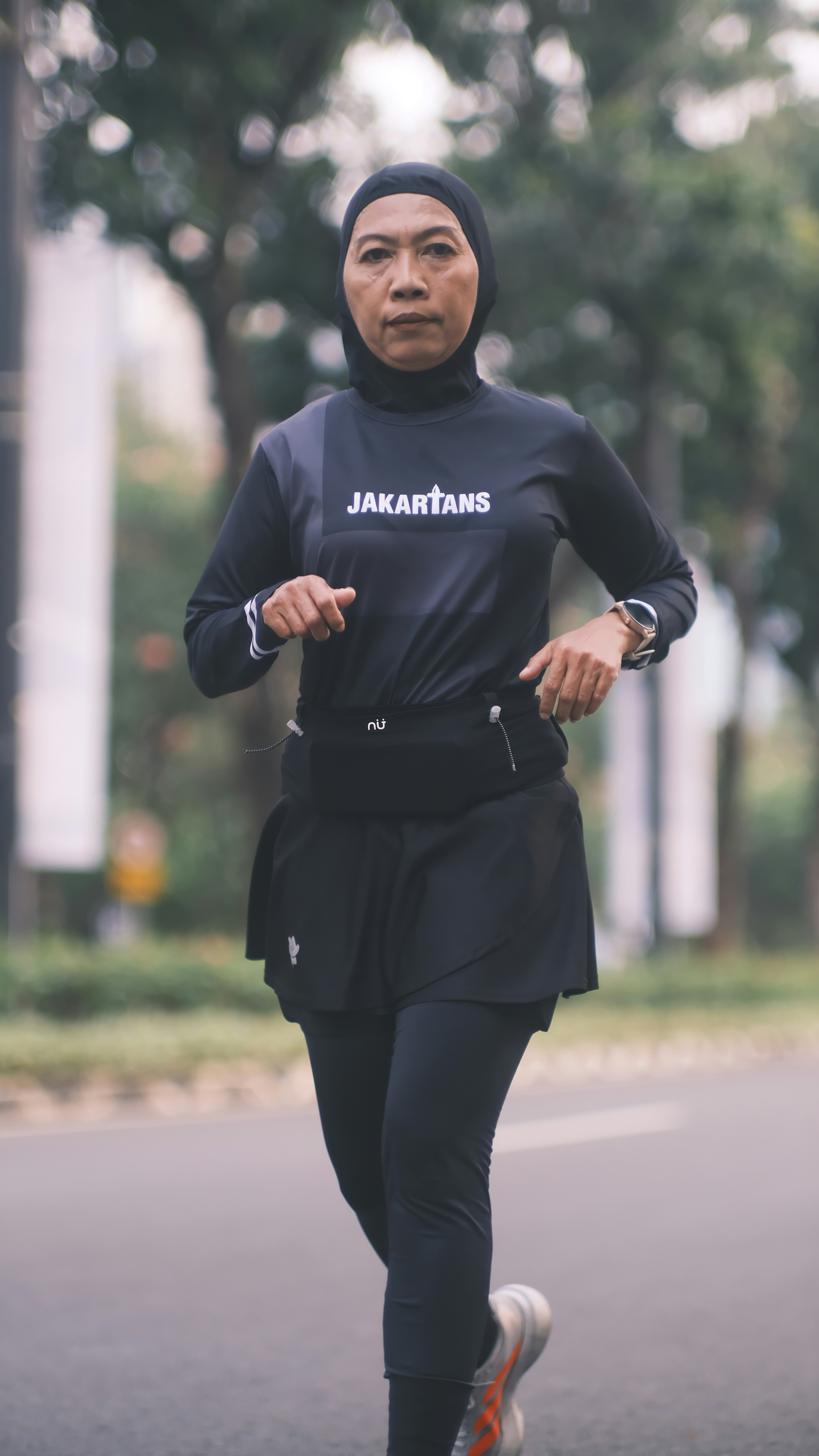 Runner in a Midnight-Hued Hijab: Focused in the Park Trail