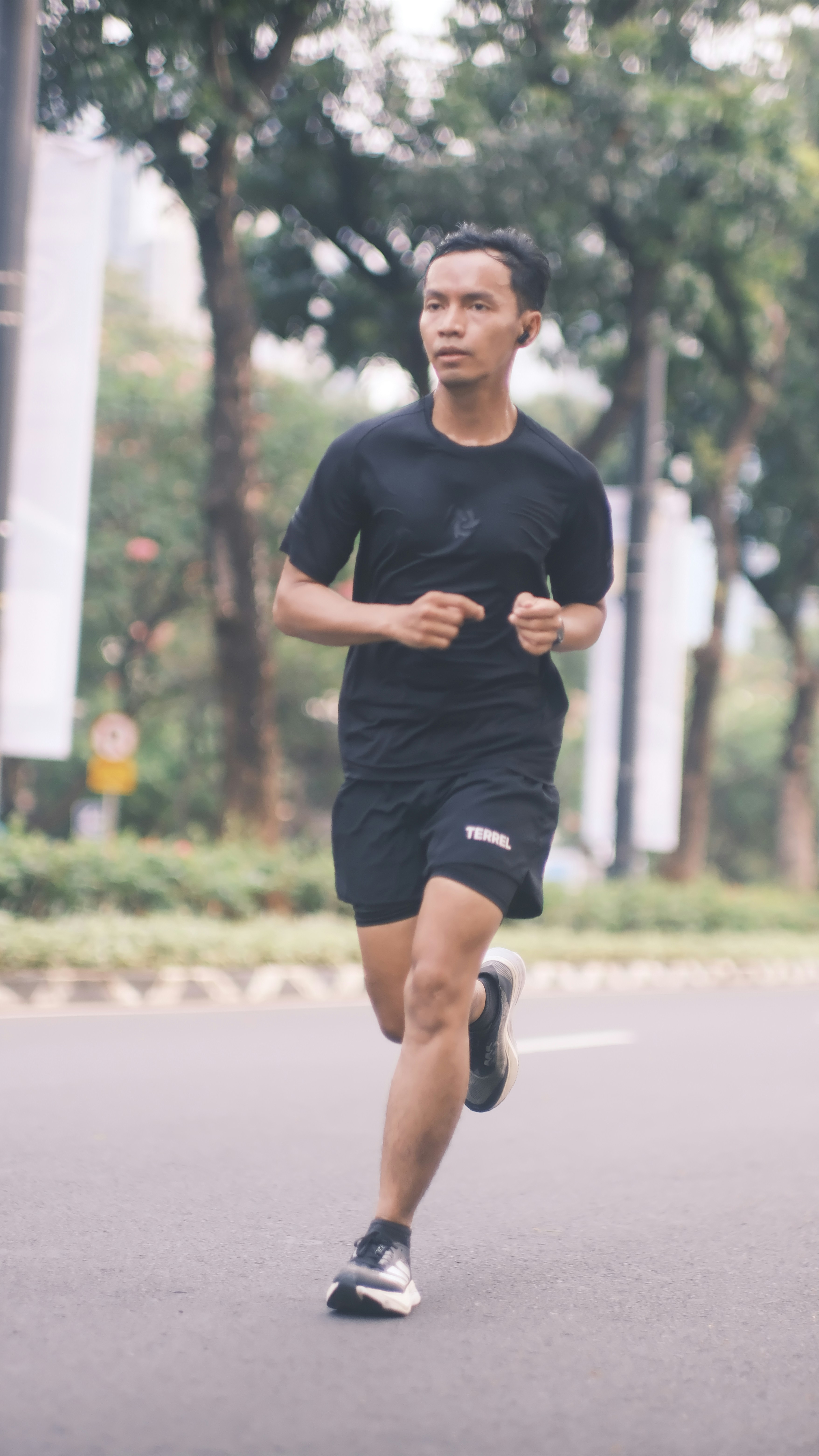 Mid-Stride Focus: Urban Runner in Soft Morning Light