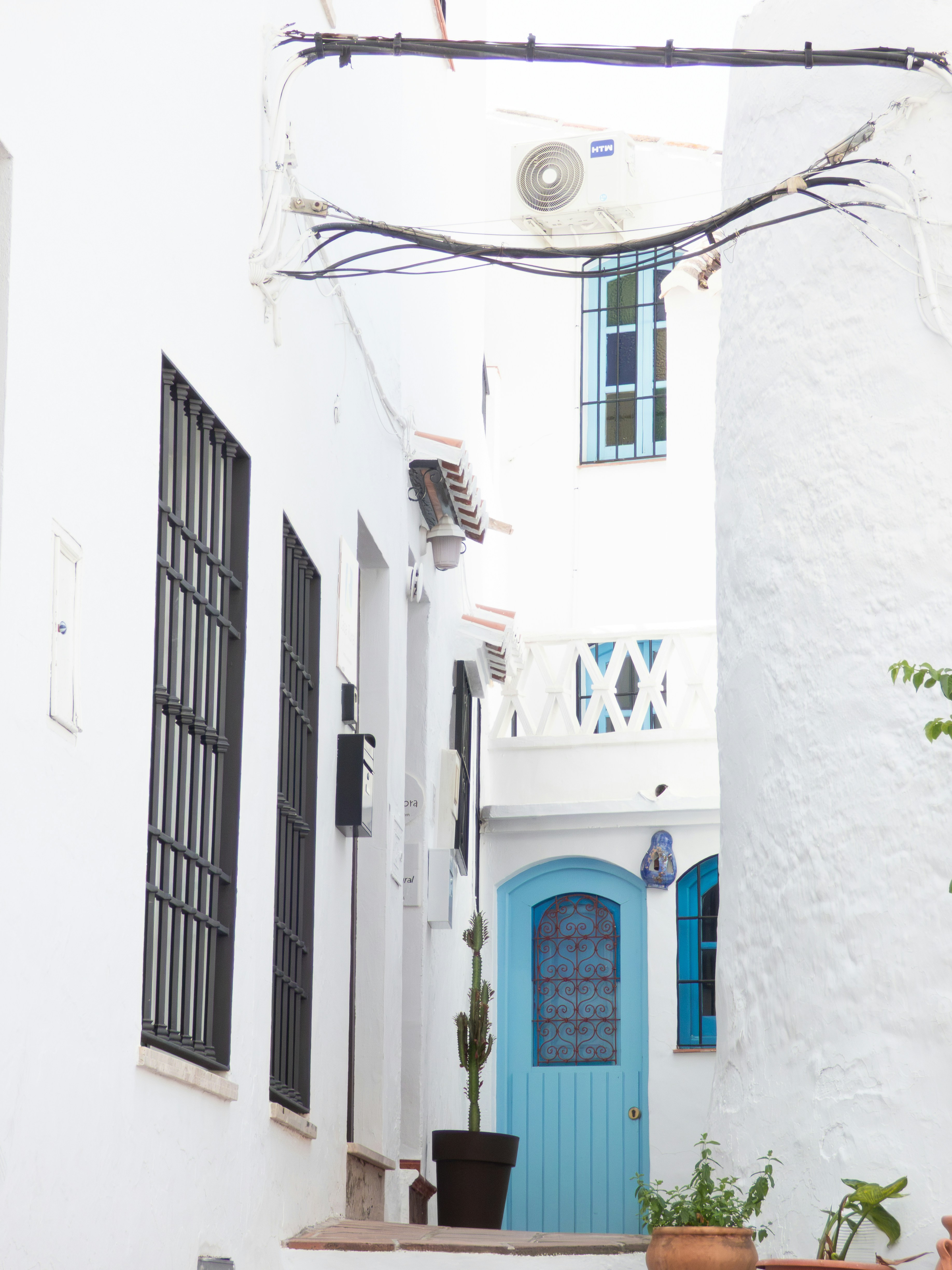 Azure Doorway in a Sunlit Cycladic Alley