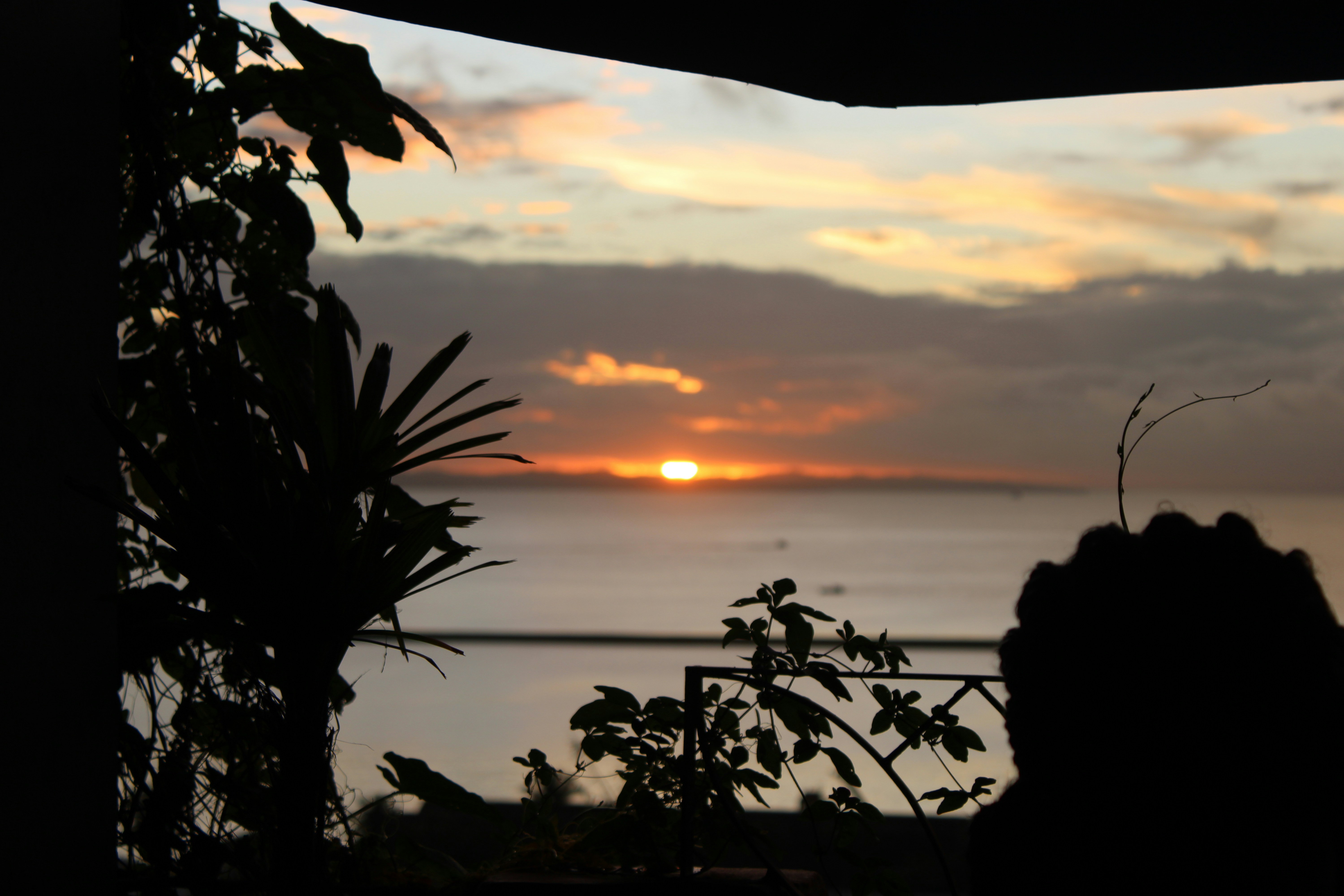 Sunset Silhouette over Calm Waters