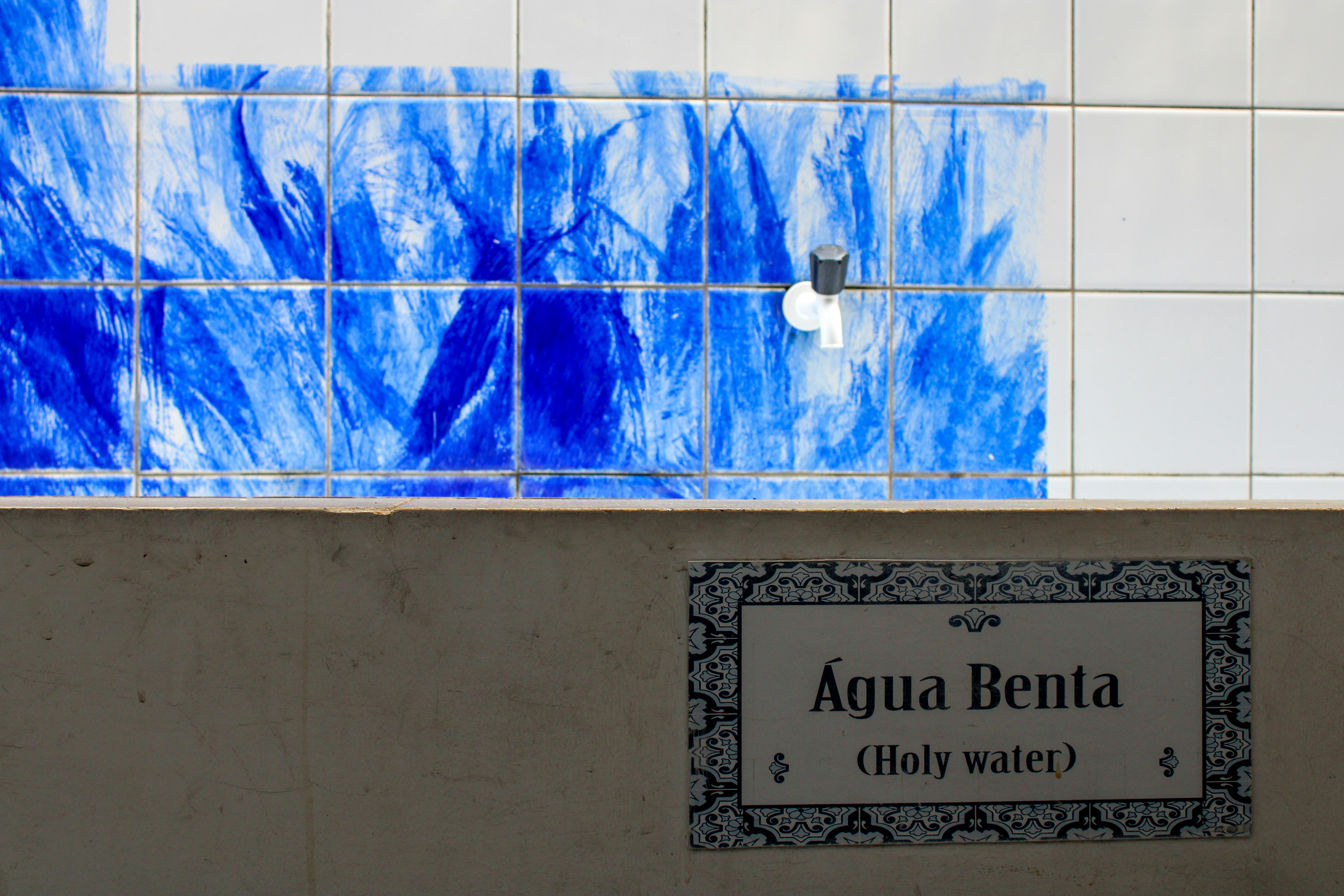Blue Tiles and Holy Water Sign