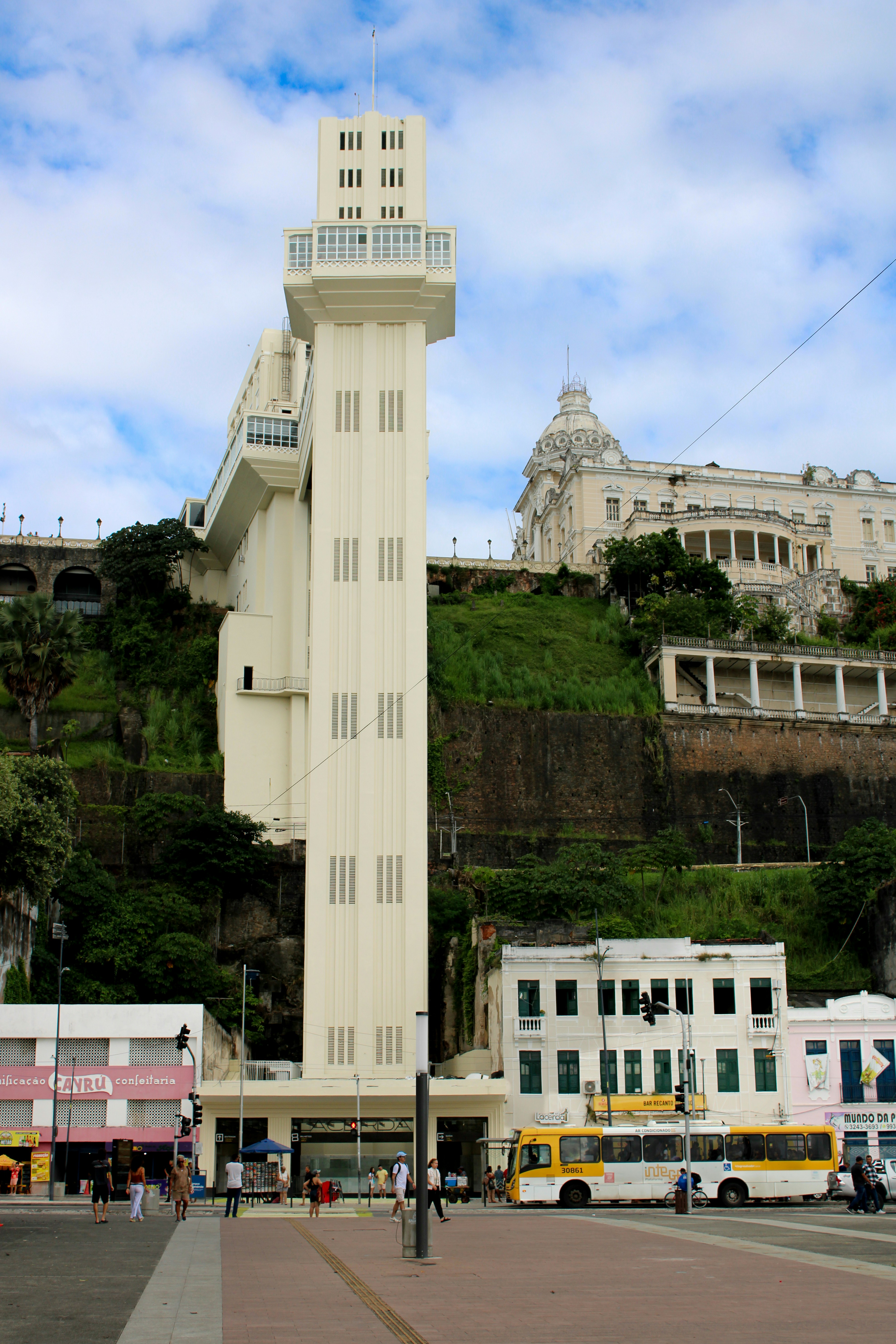 Ascending Concrete: The Elevator Tower Overlooking a Coastal Plaza
