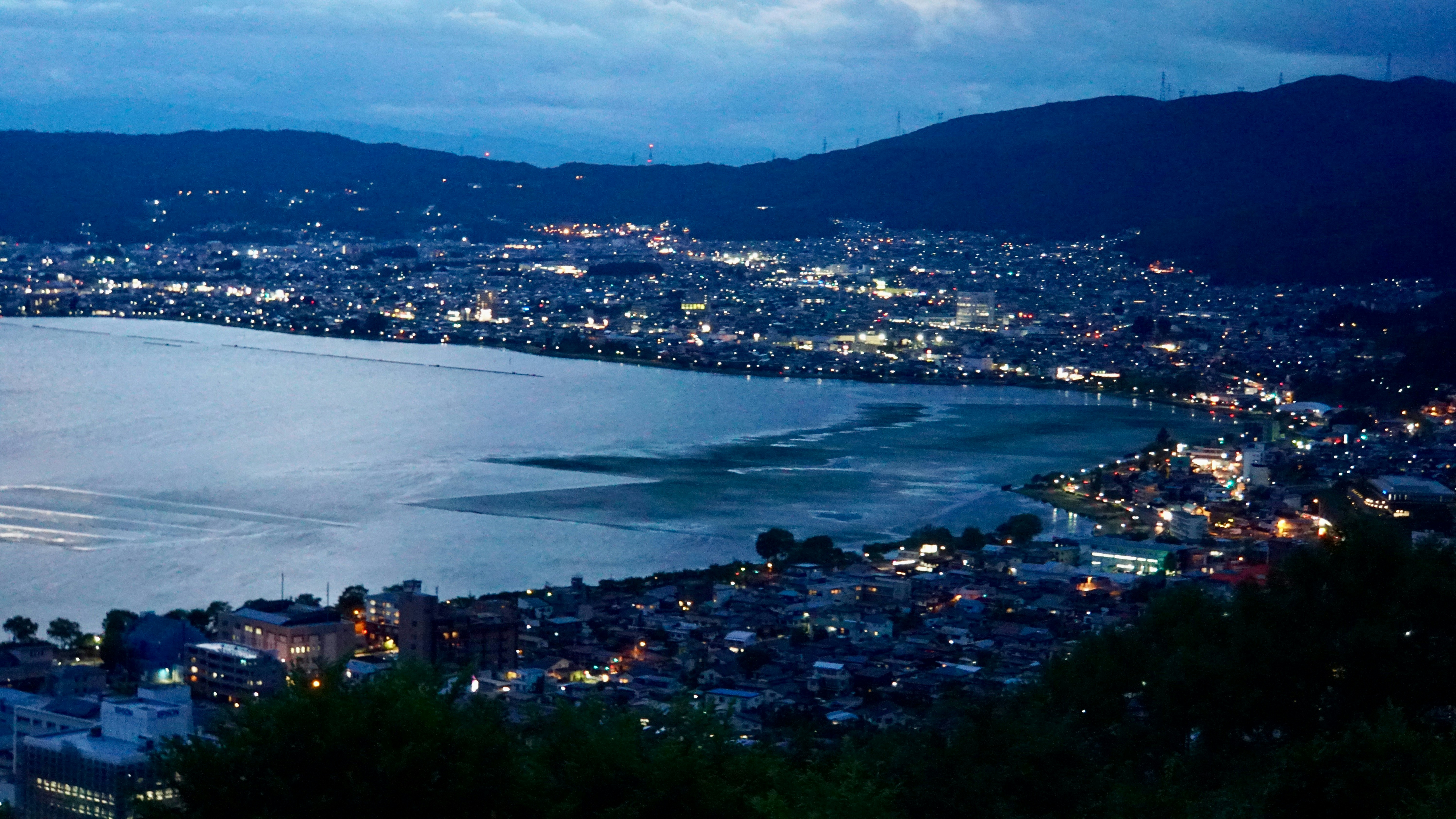 City Lights Along the Coast: Evening Snapped from a Hillside