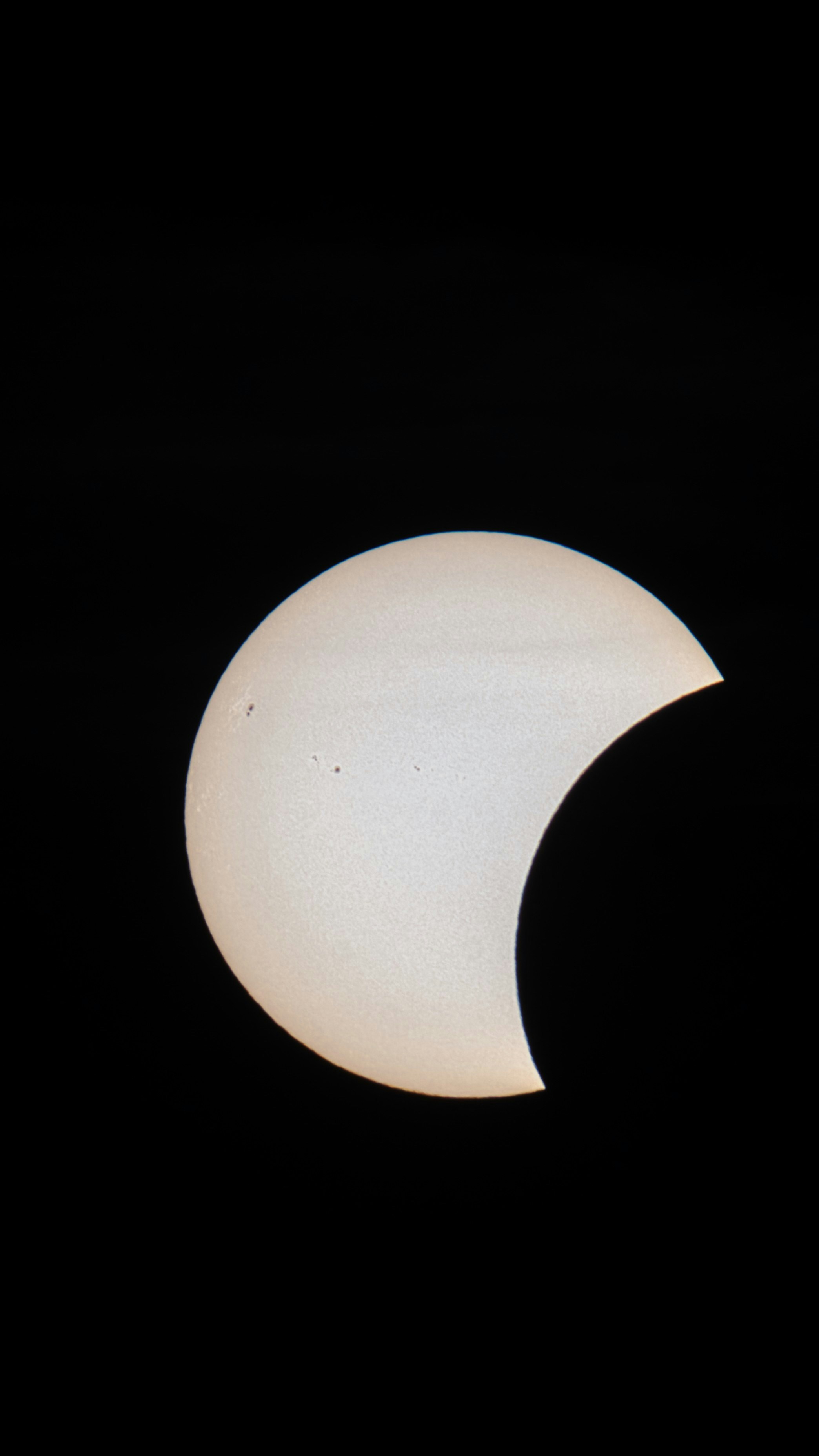 Crescent Moon Emerges: A Quiet Solar Eclipse Moment