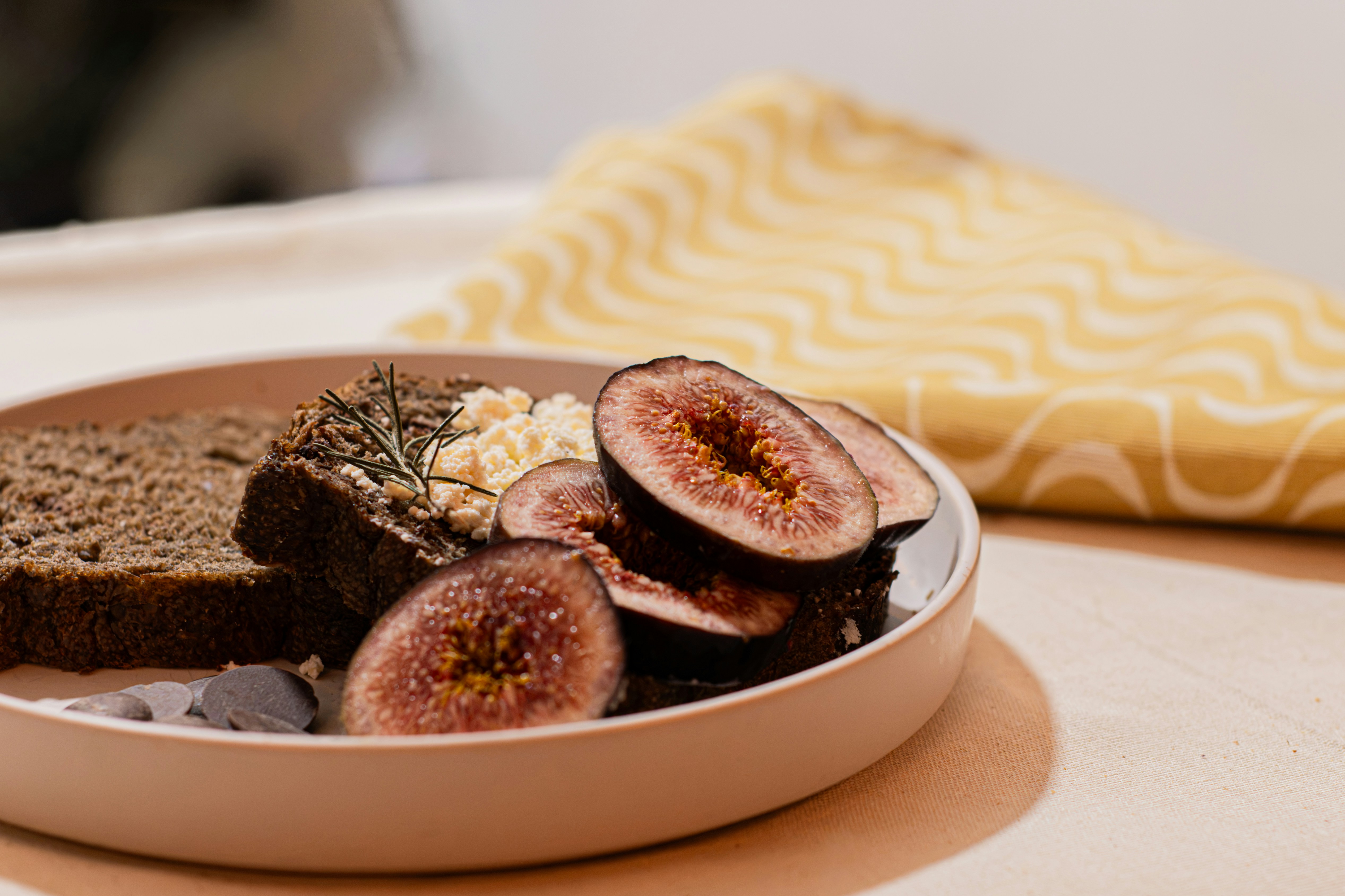 Fig slices on a plate: a soft-focus breakfast still life