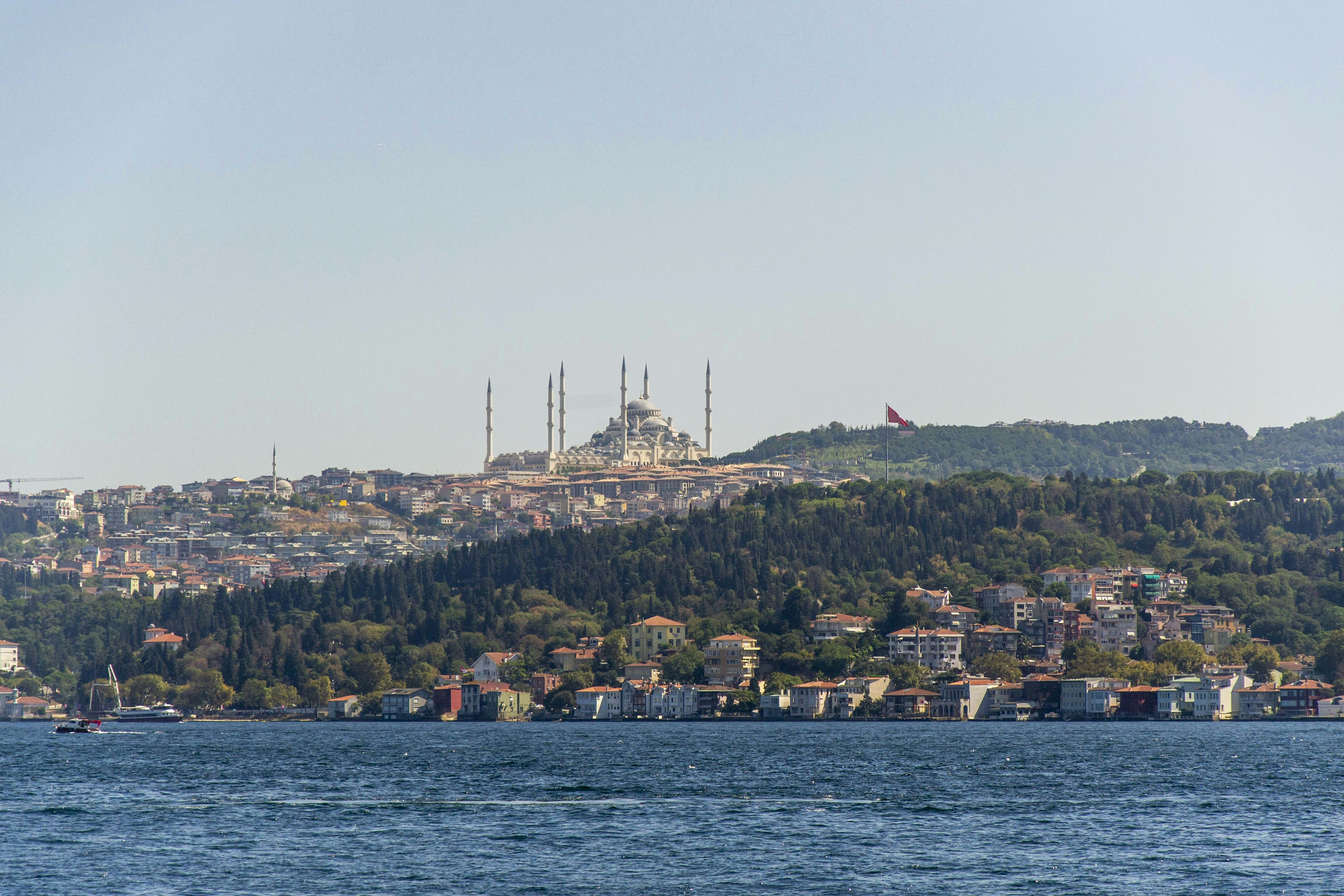 Hillside Mosque Silhouettes Across a Calm Sea