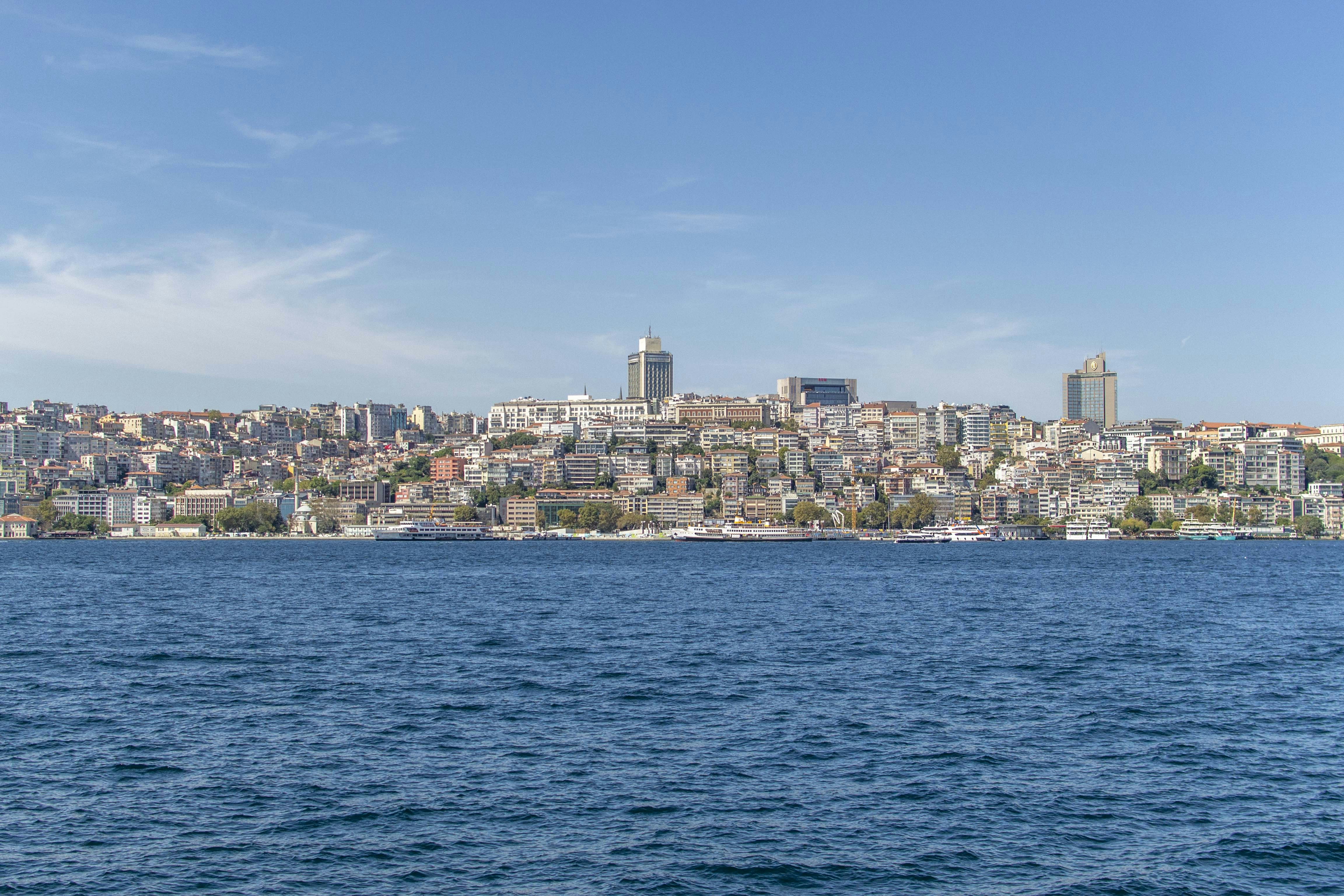Coastal City Skyline Rising from the Calm Blue Sea