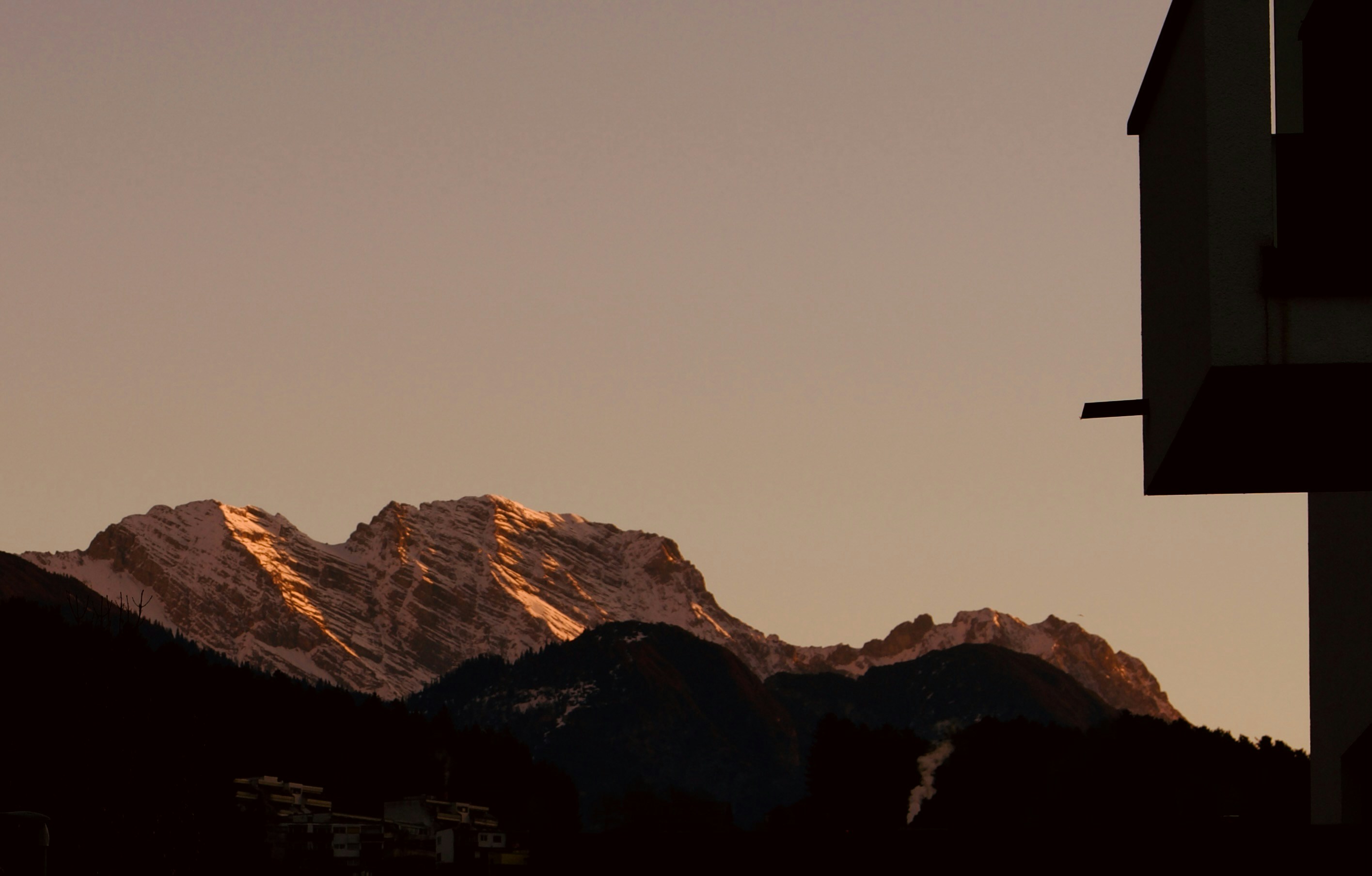 Distant Peaks at Dusk: Shadows Over the Quiet Balcony