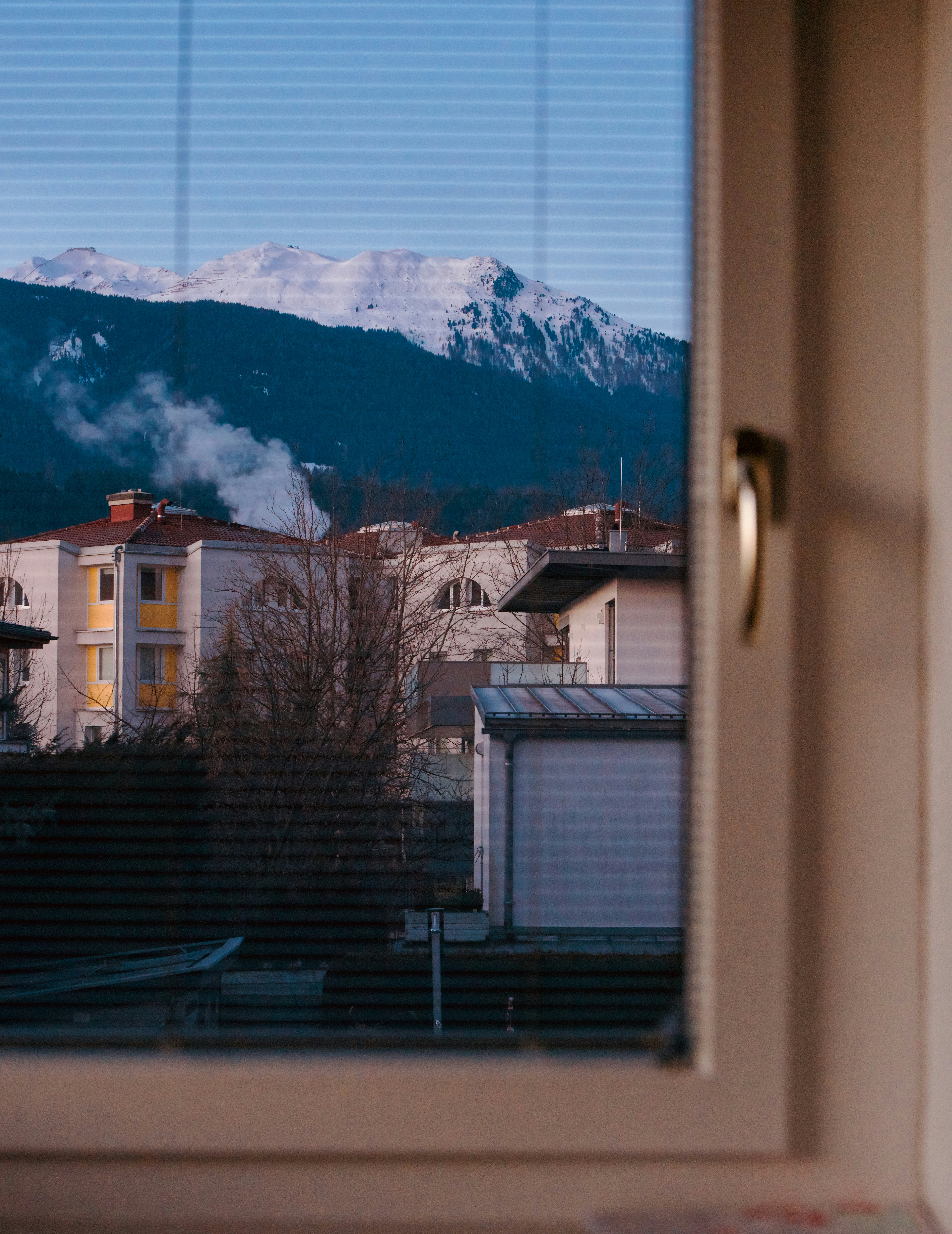 Snow-capped Peaks Beyond a Cozy Window
