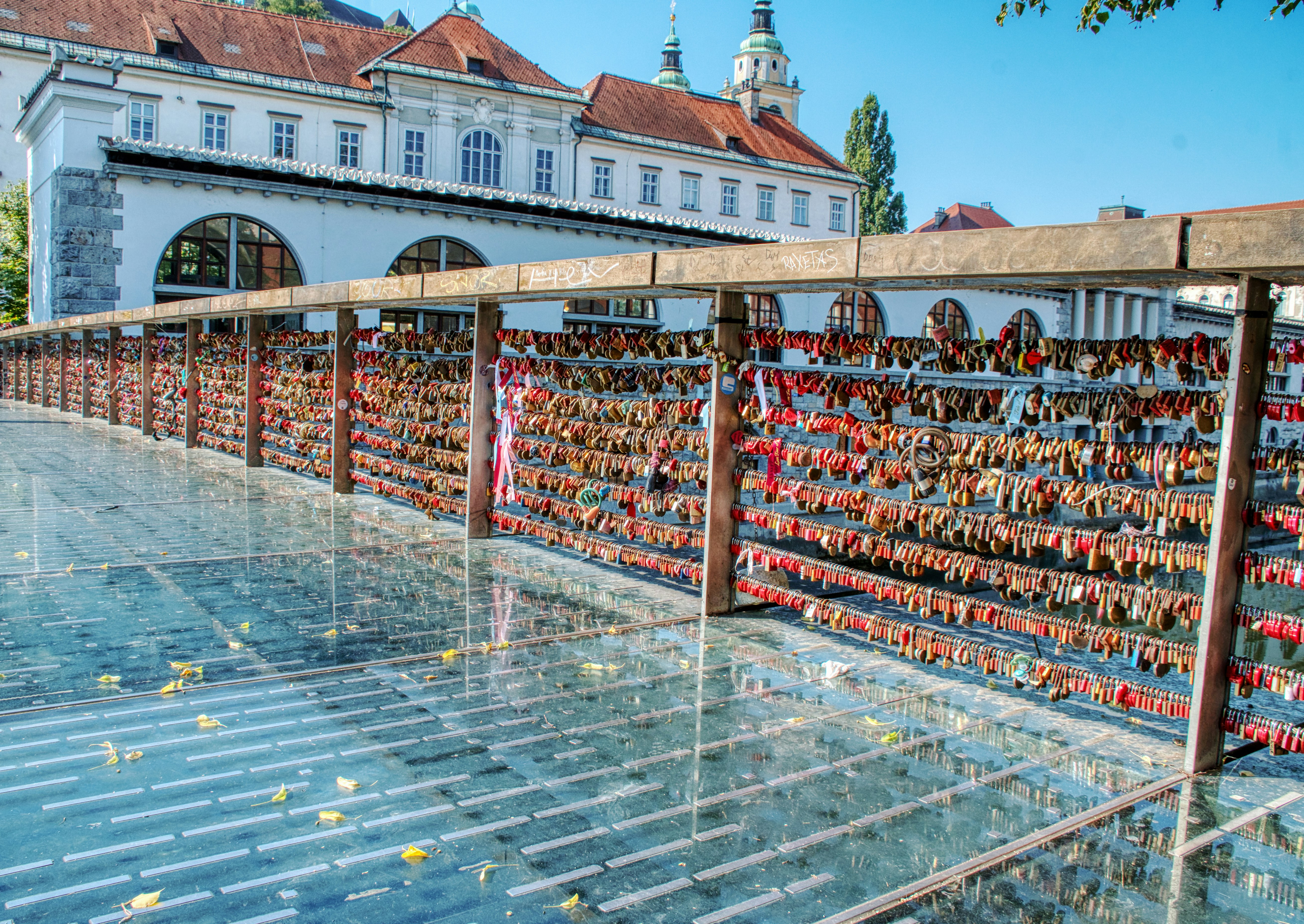 Locks of Memory: A Bridge of Wishes Over Glassy Waters