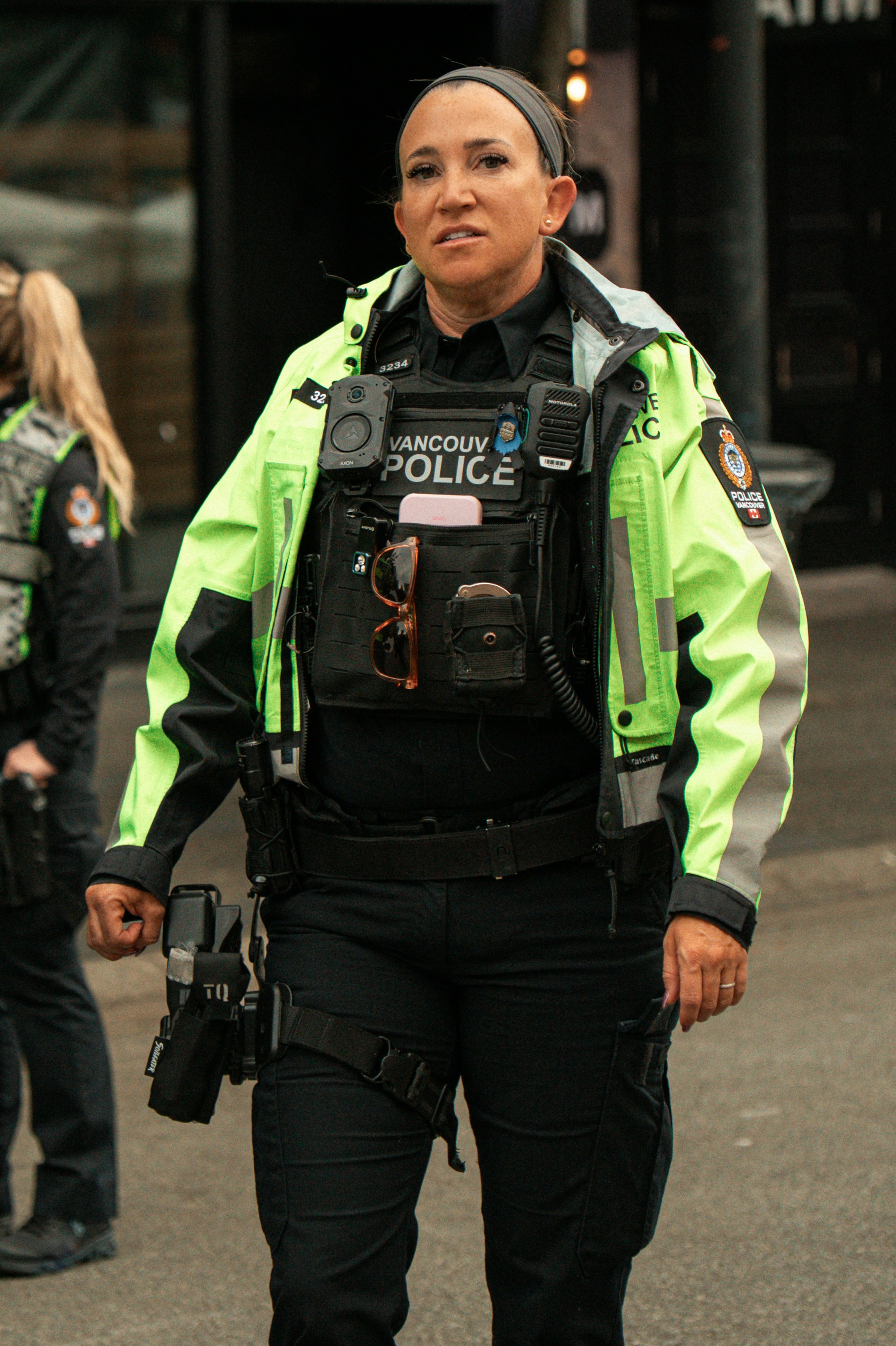 Vancouver Police Officer in High-Visibility Gear on City Street