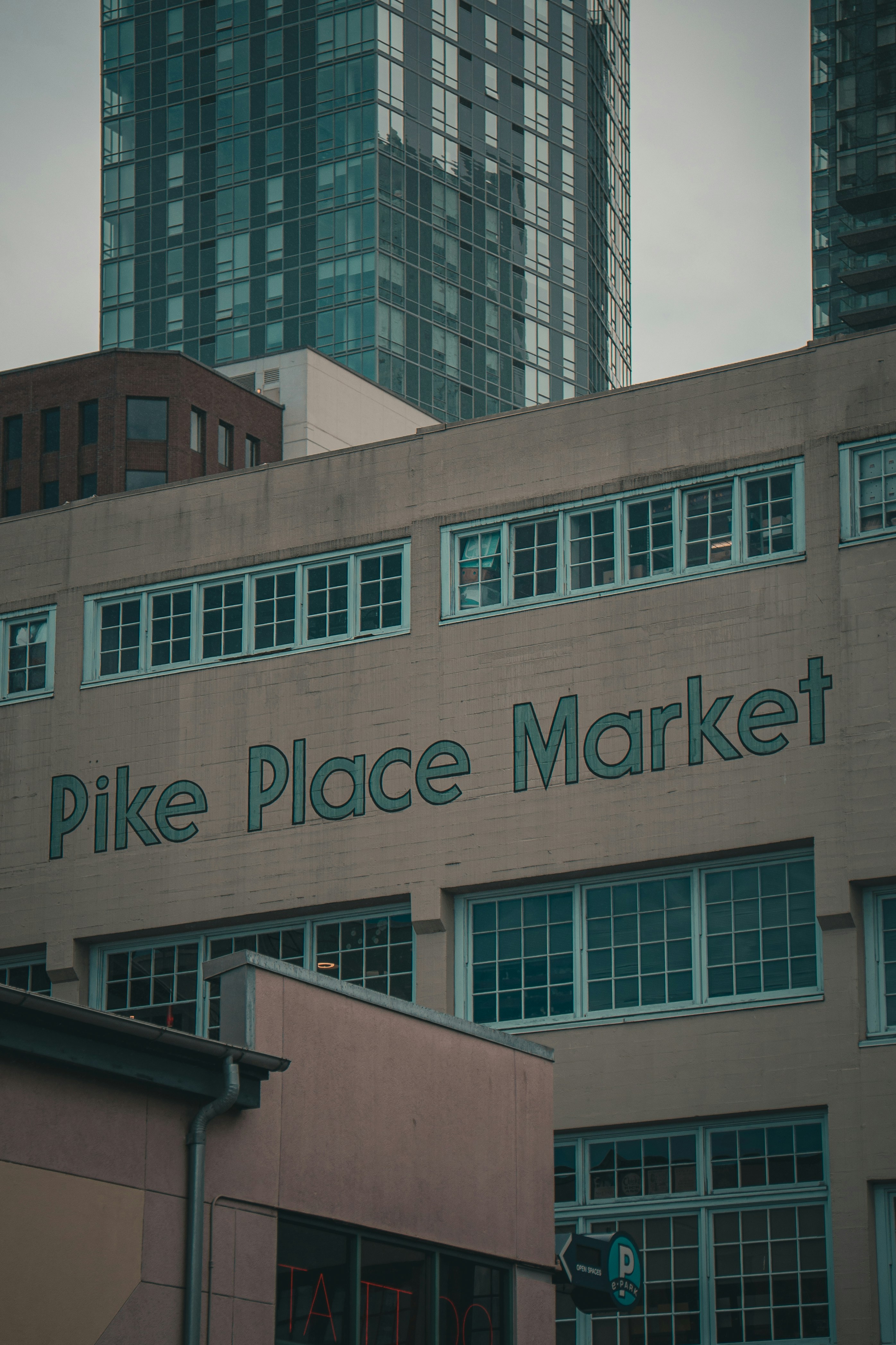 Pike Place Market Sign Under Urban Silhouette
