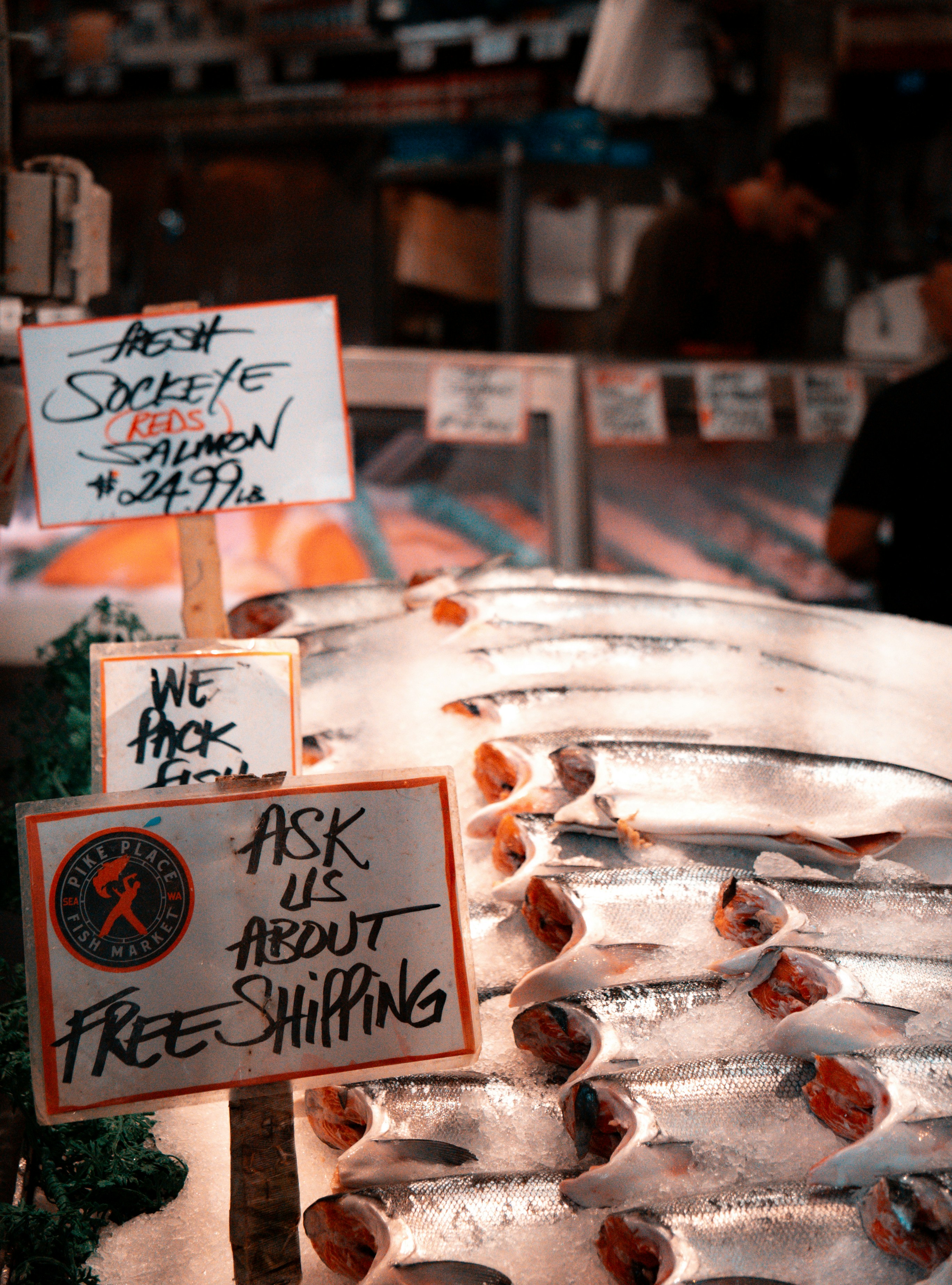 Market Signage Over Fresh Salmon: A Farm-to-Display Moment