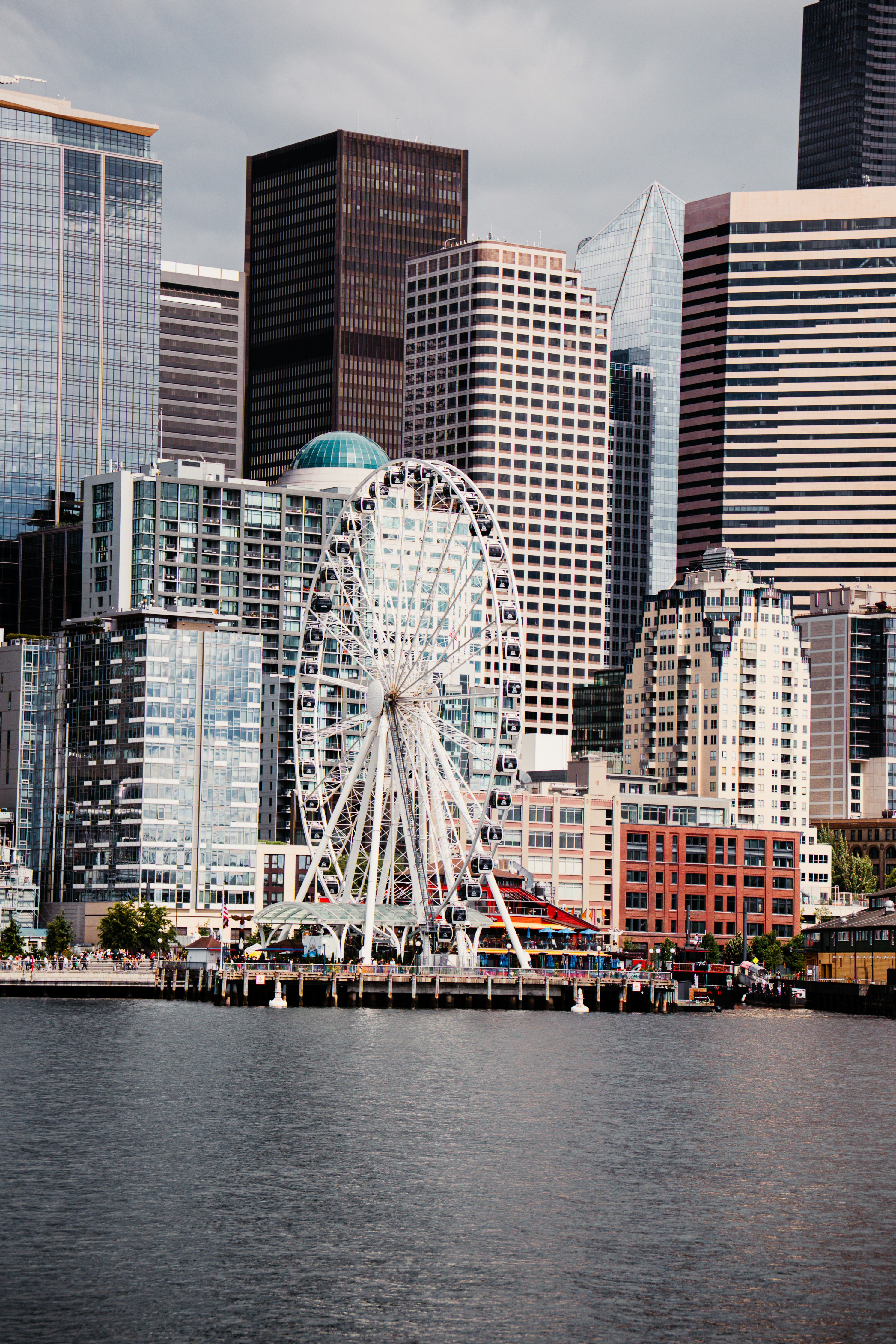 Giant Ferris Wheel Framing a Skyline Waterfront