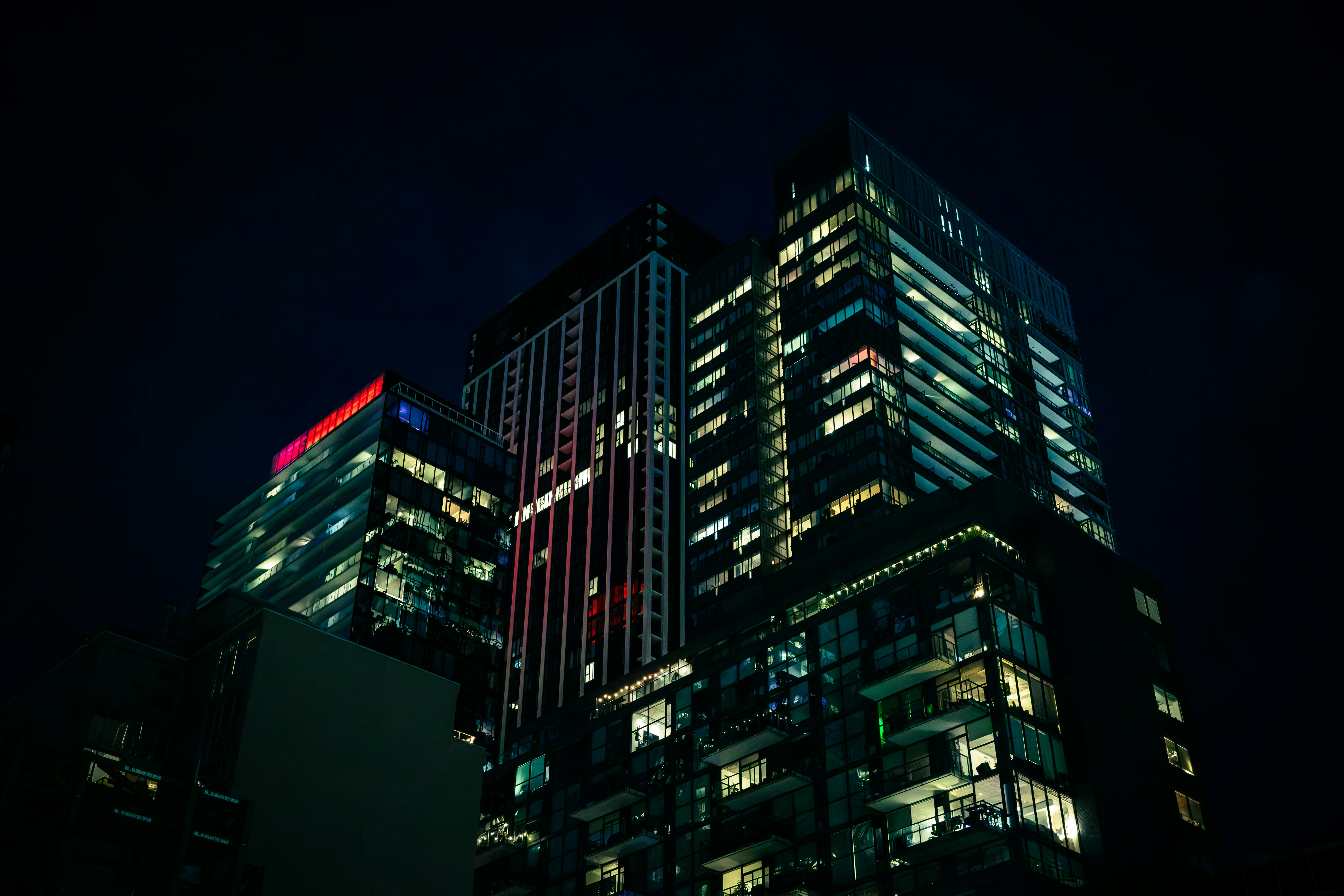 Midnight Glass & Neon: Towers Reach the Dark Sky