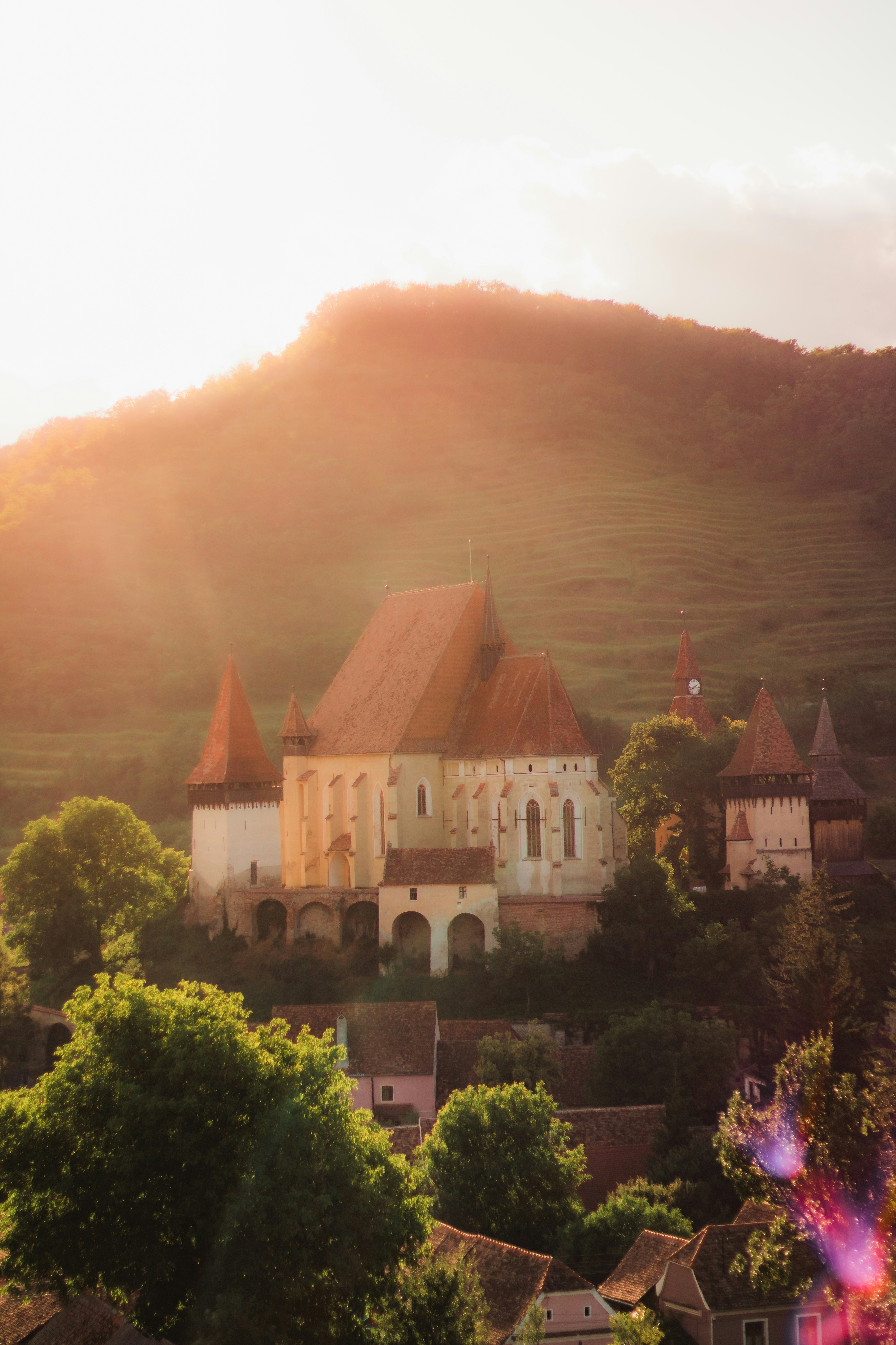 Sunlit fortress crowned by hilltop light