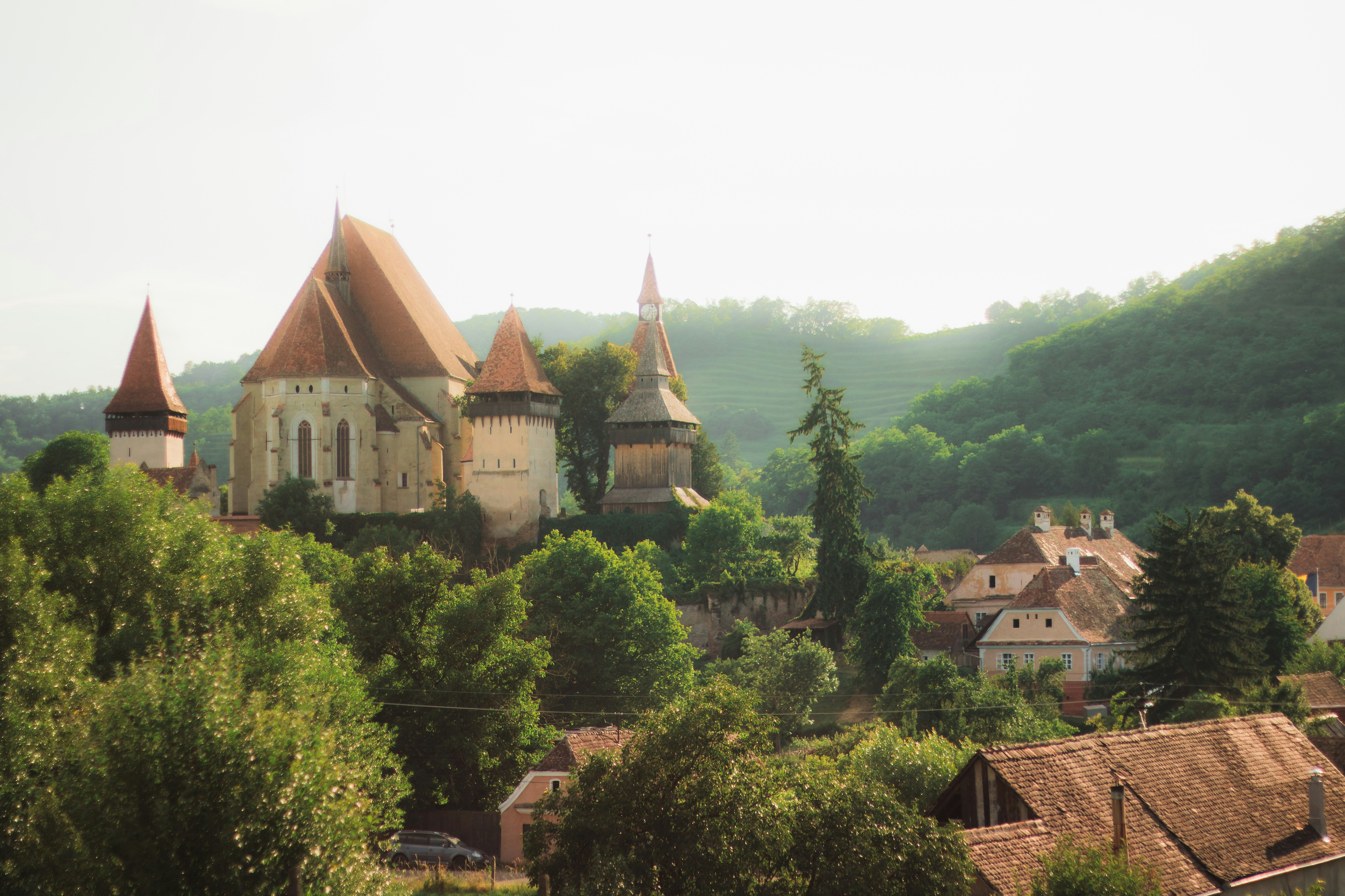 Castle in the Green Valley: Towers Rising Above a Quiet Village