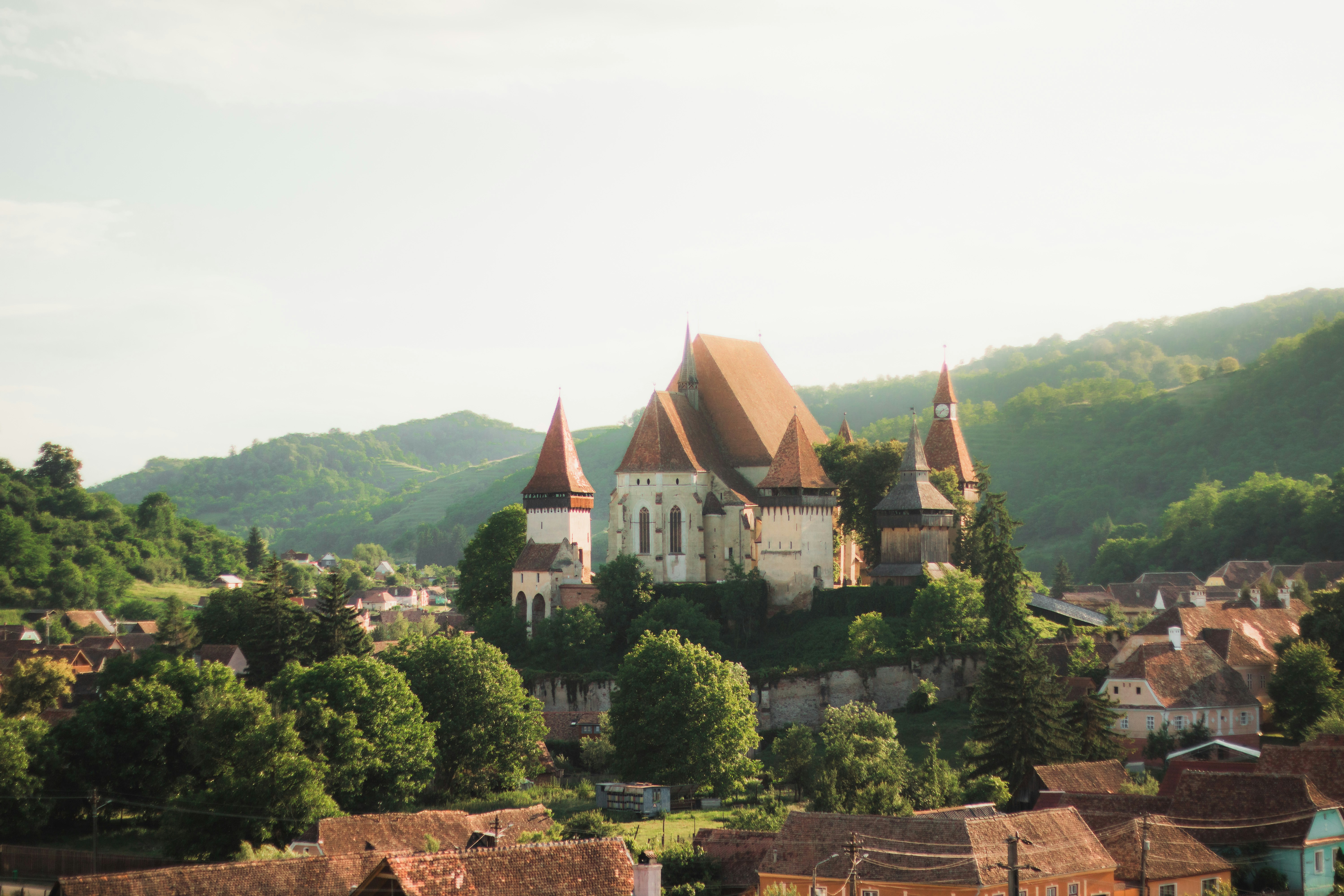 Castle on the Hill: A Romanique Fortress Rising Above a Tiled Village