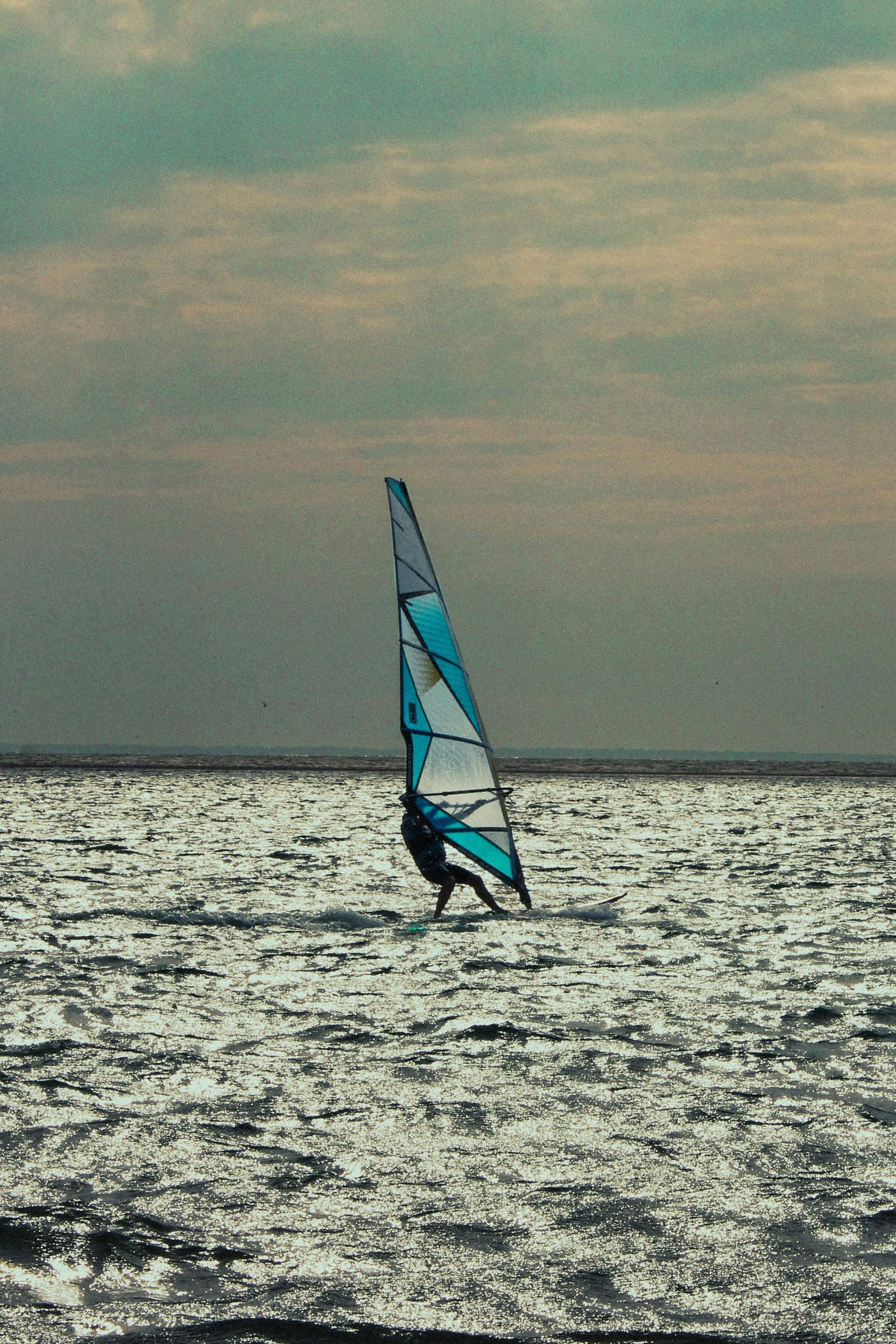 Windward Focus: Windsurfer Tilts Toward the Horizon