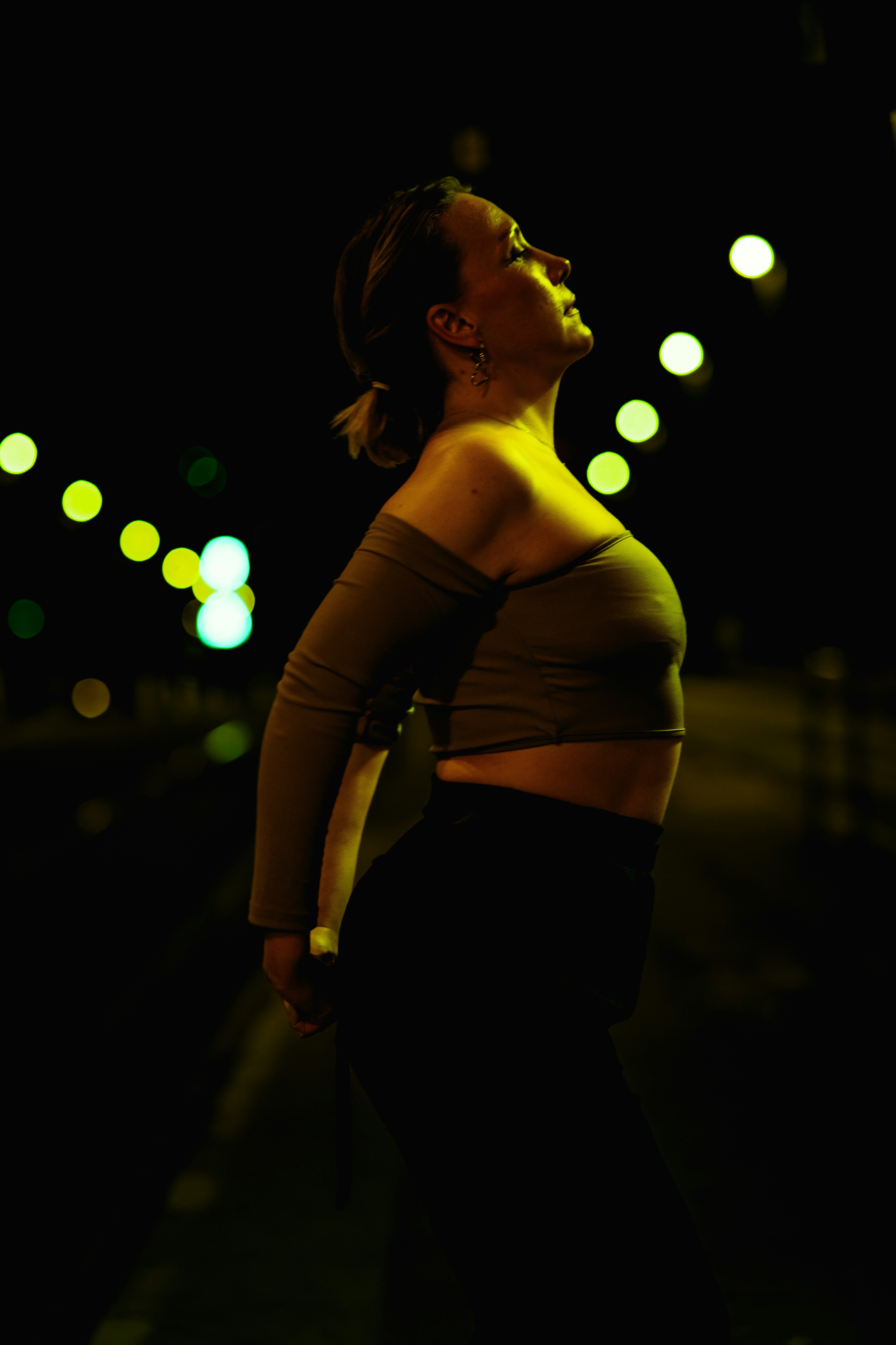 Night Escape: Silhouette in Streetlight Gloaming