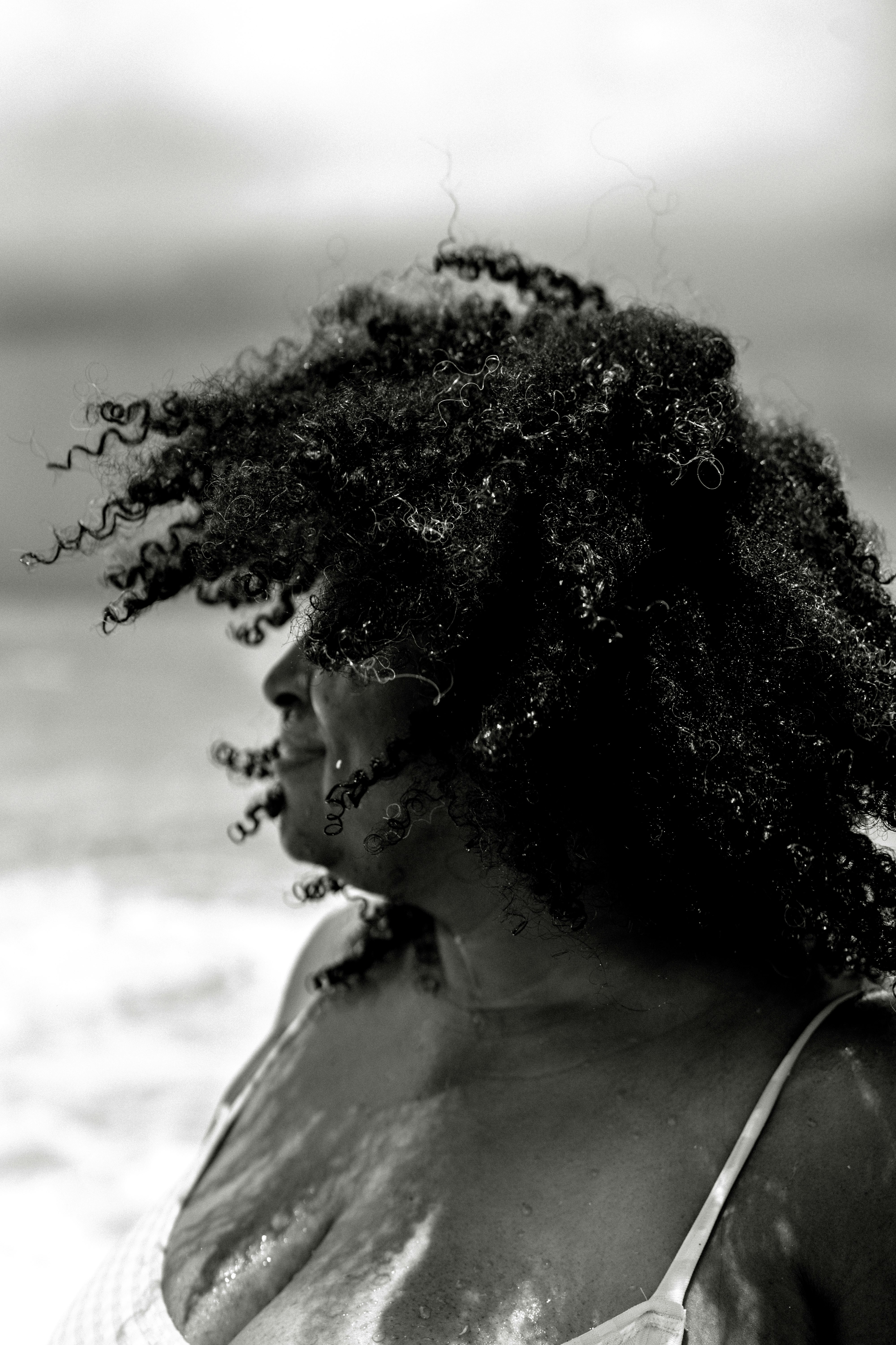 Portrait in Wind: Chrome curls and sunlit shoreline