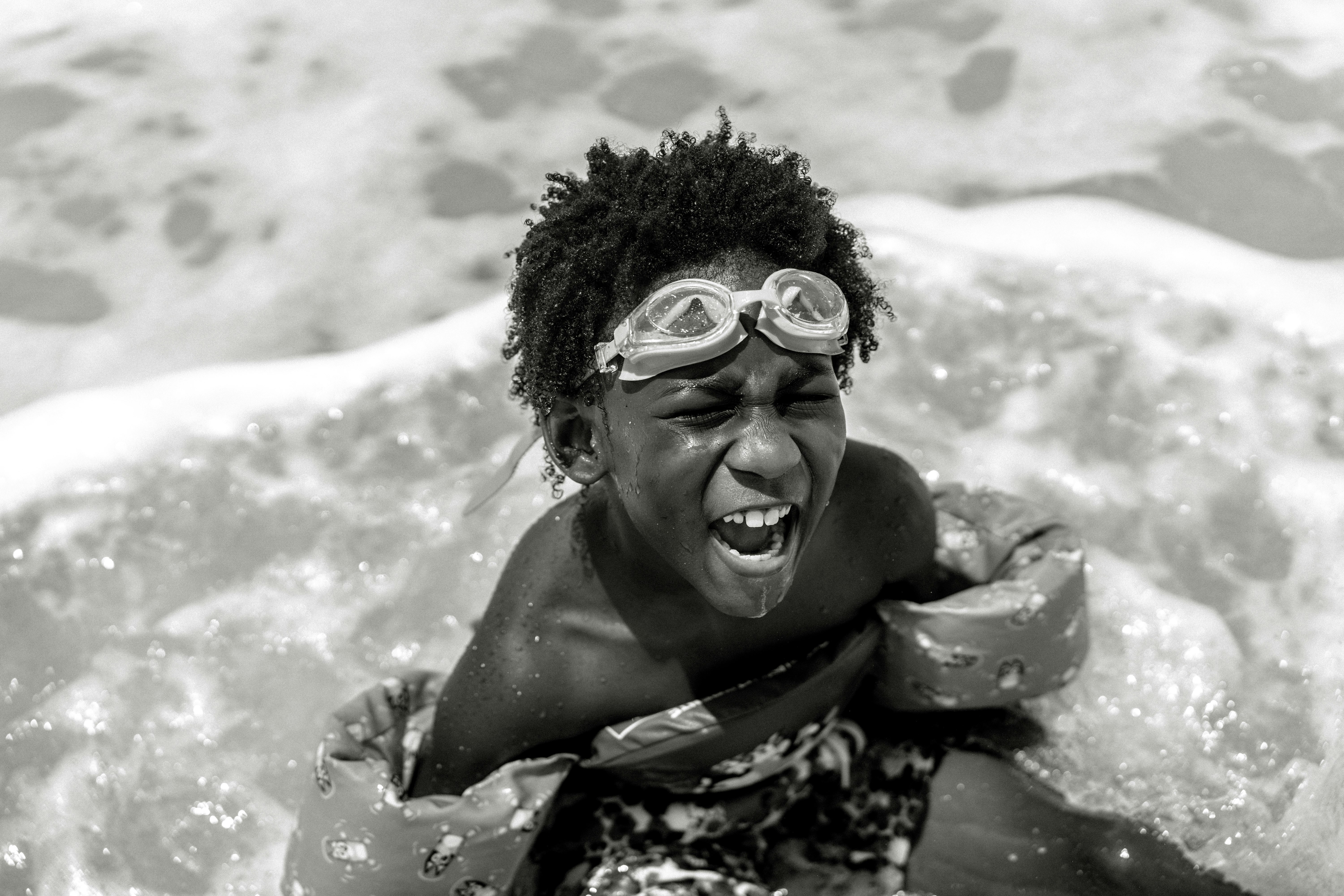 Gleeful Splash: Eye Contact and Goggle Grin in the Waves
