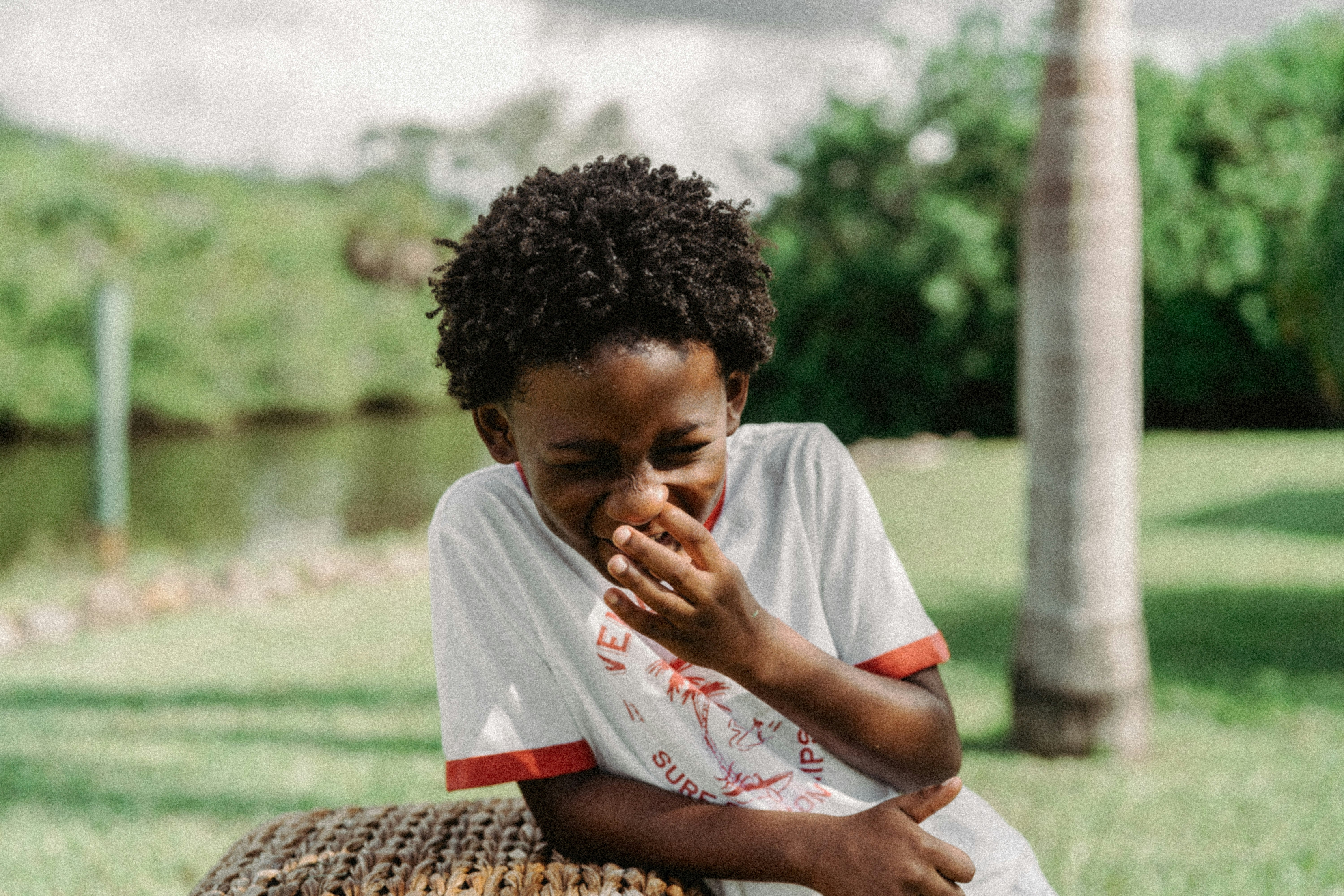 Laughter in the Park: A Child's Quiet Moment