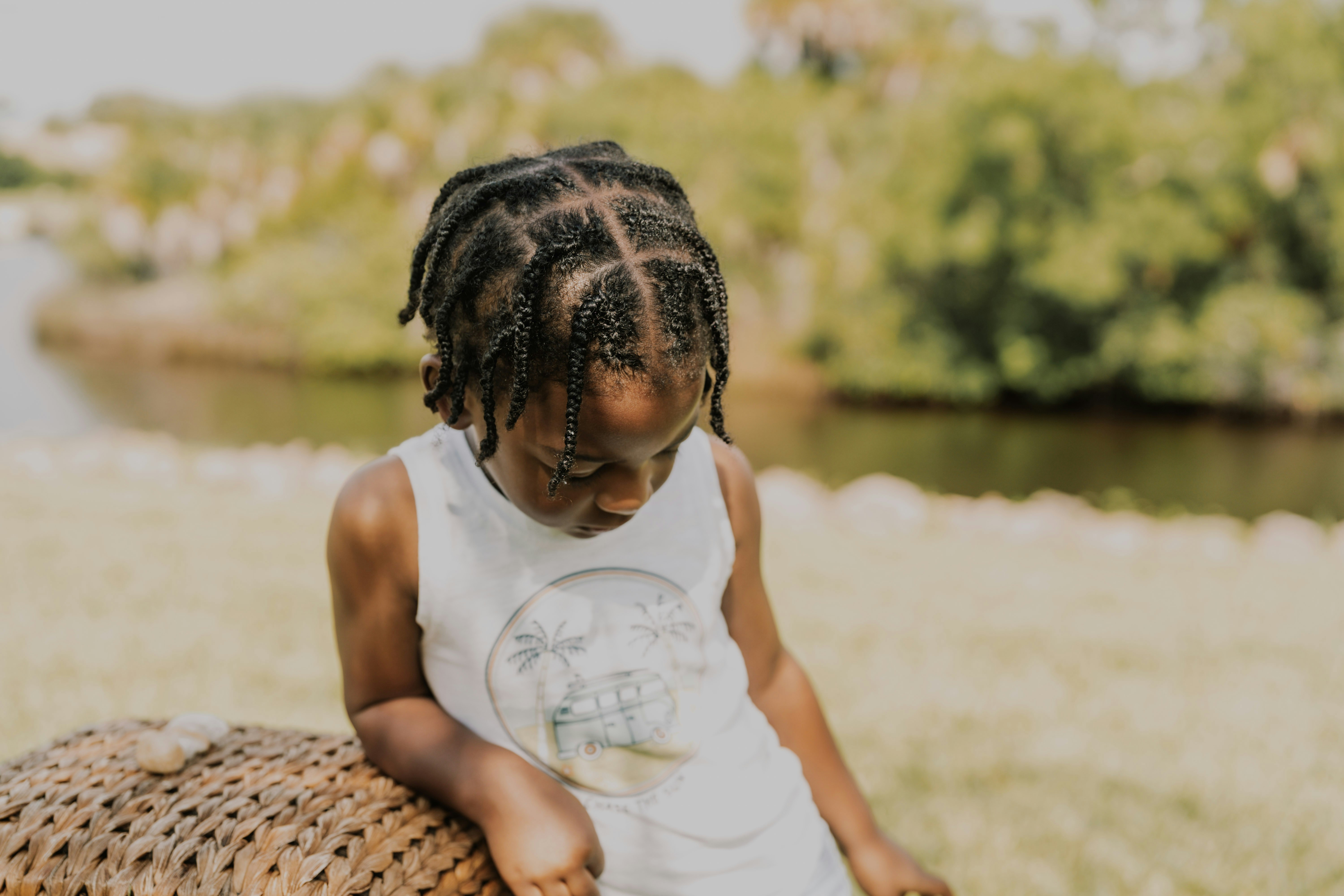 Child in Quiet Afternoon Light by the Water