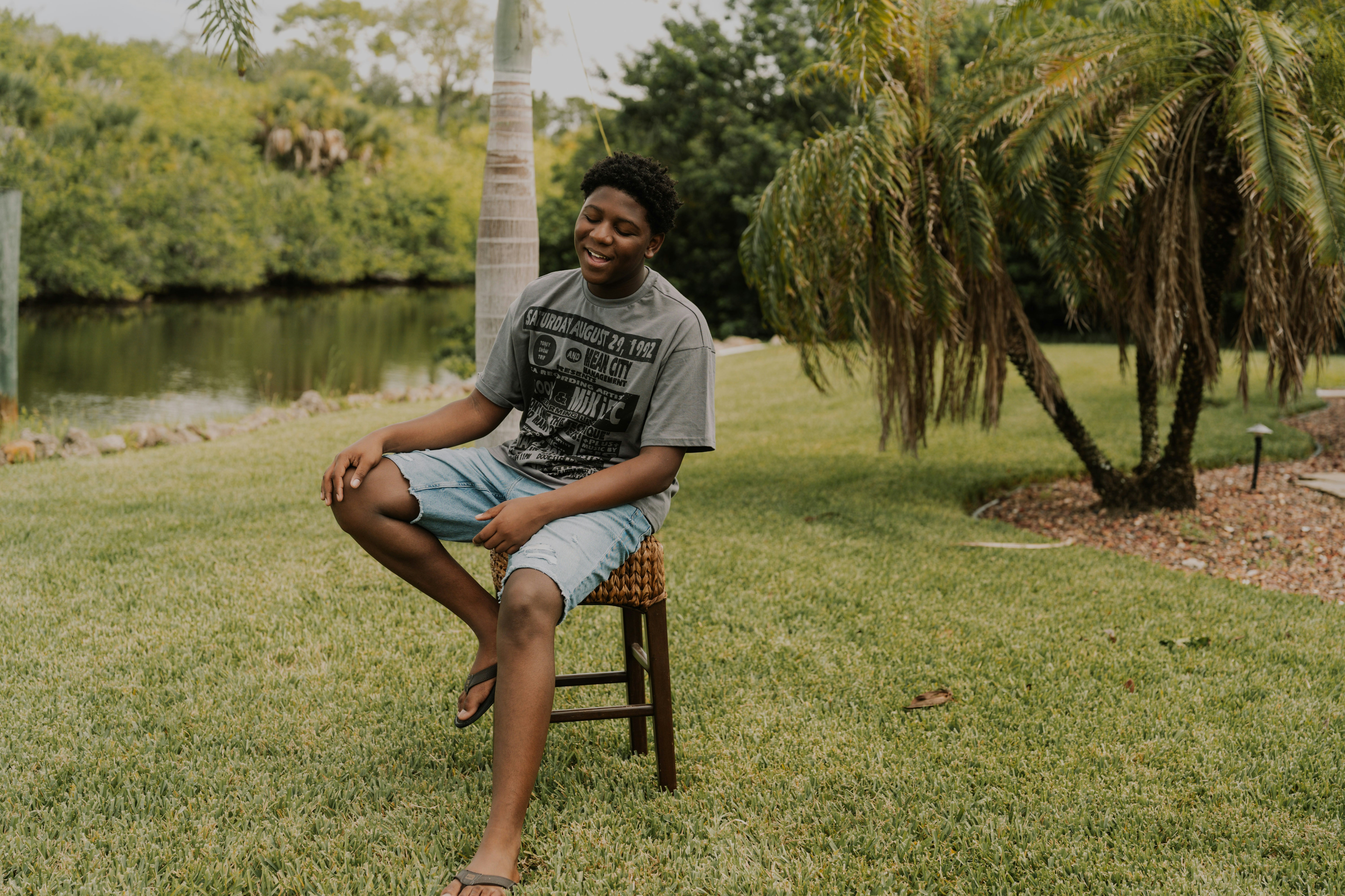 Relaxed Portrait Under Palm Canopy
