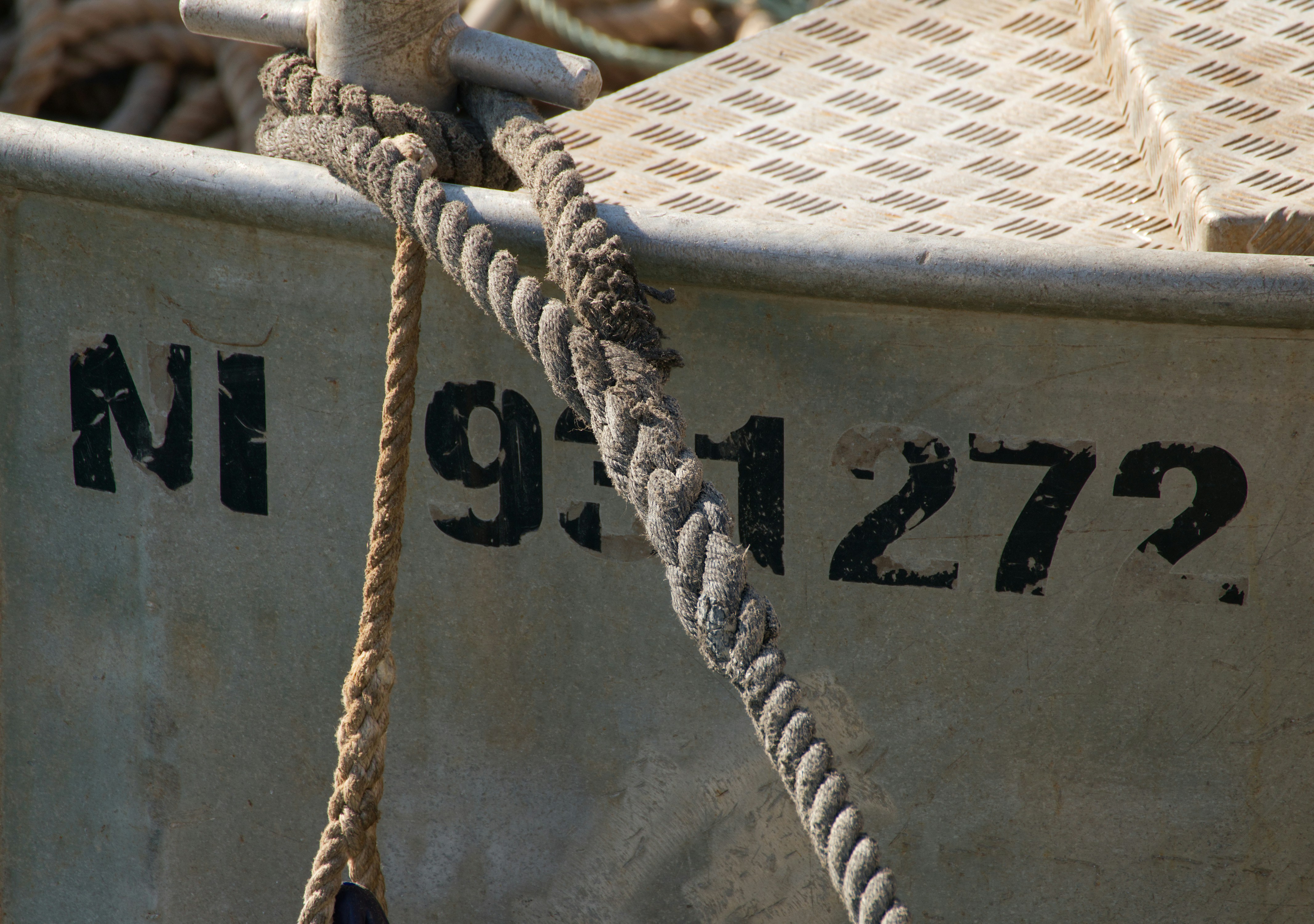 Rugged Docklines: A Closer Look at Weathered Metal and Rope