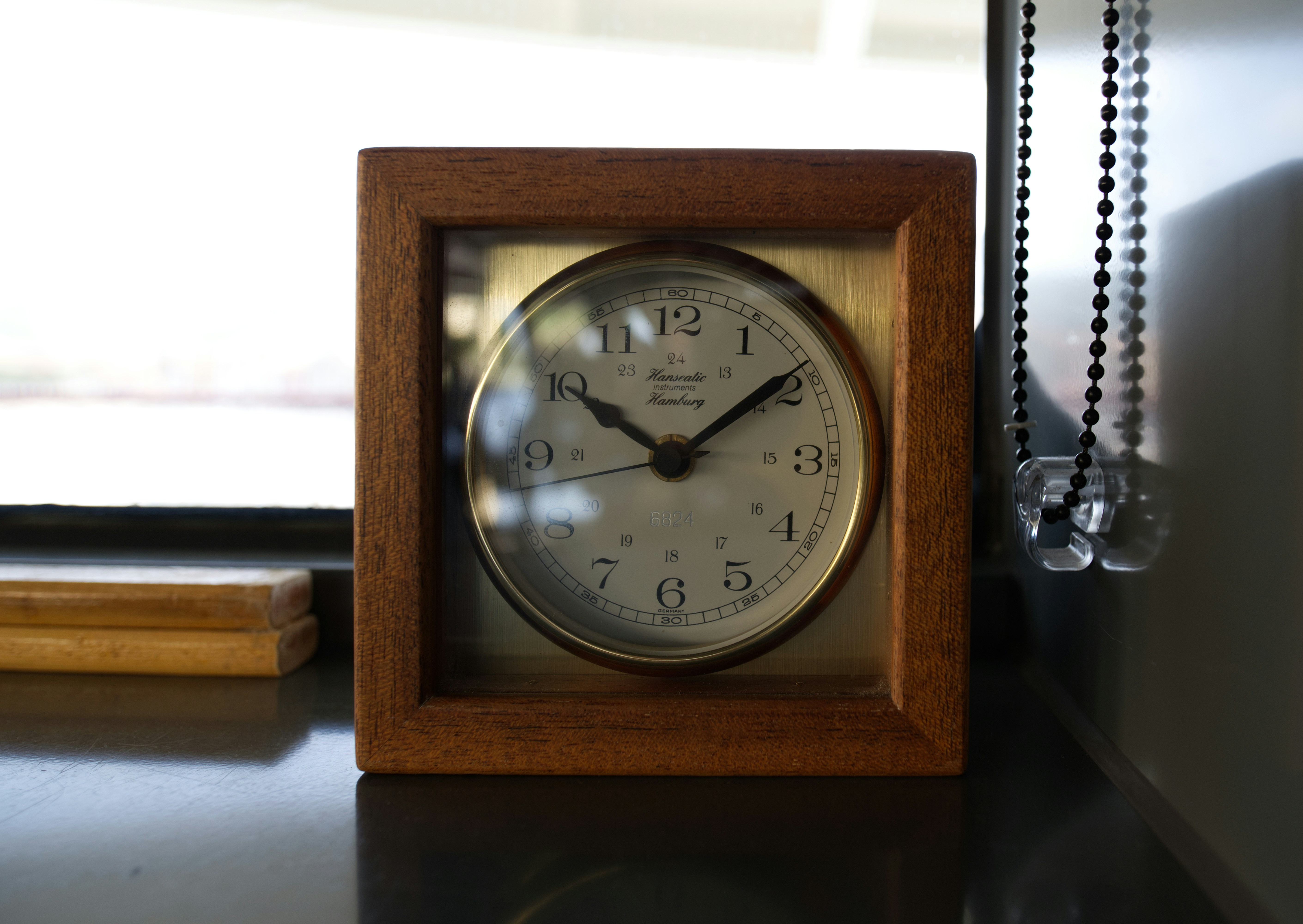 Amber Clock in a Quiet Windowsill Moment