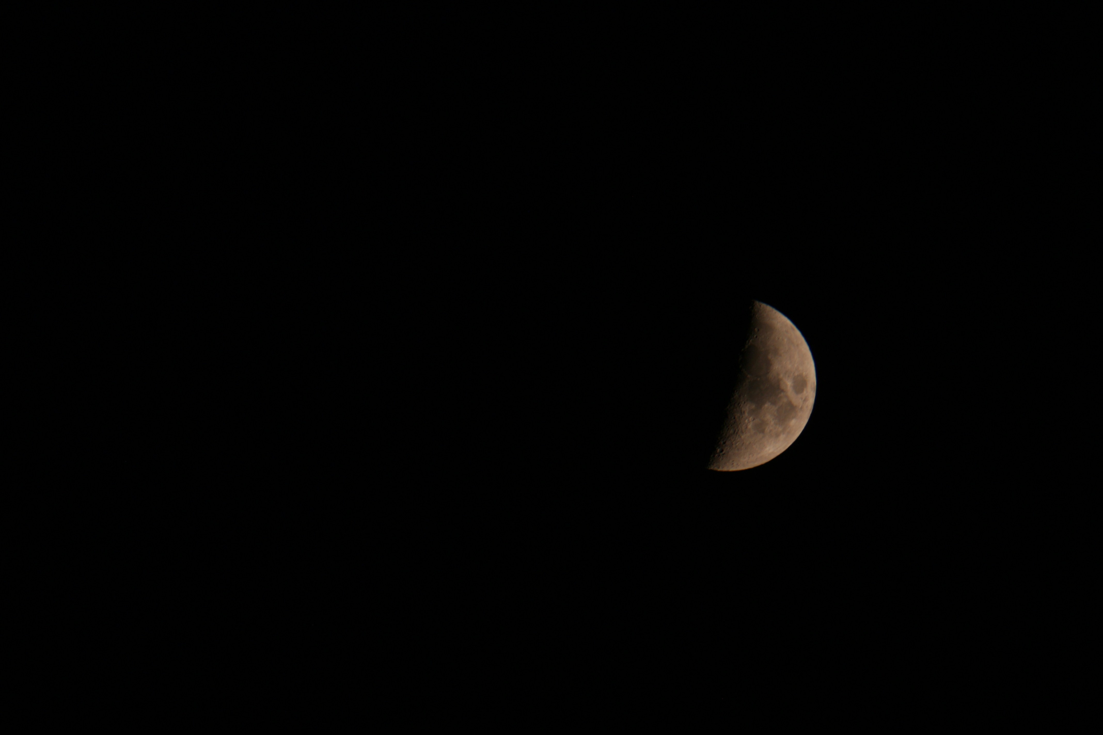 Crescent Moon Emerges from Night