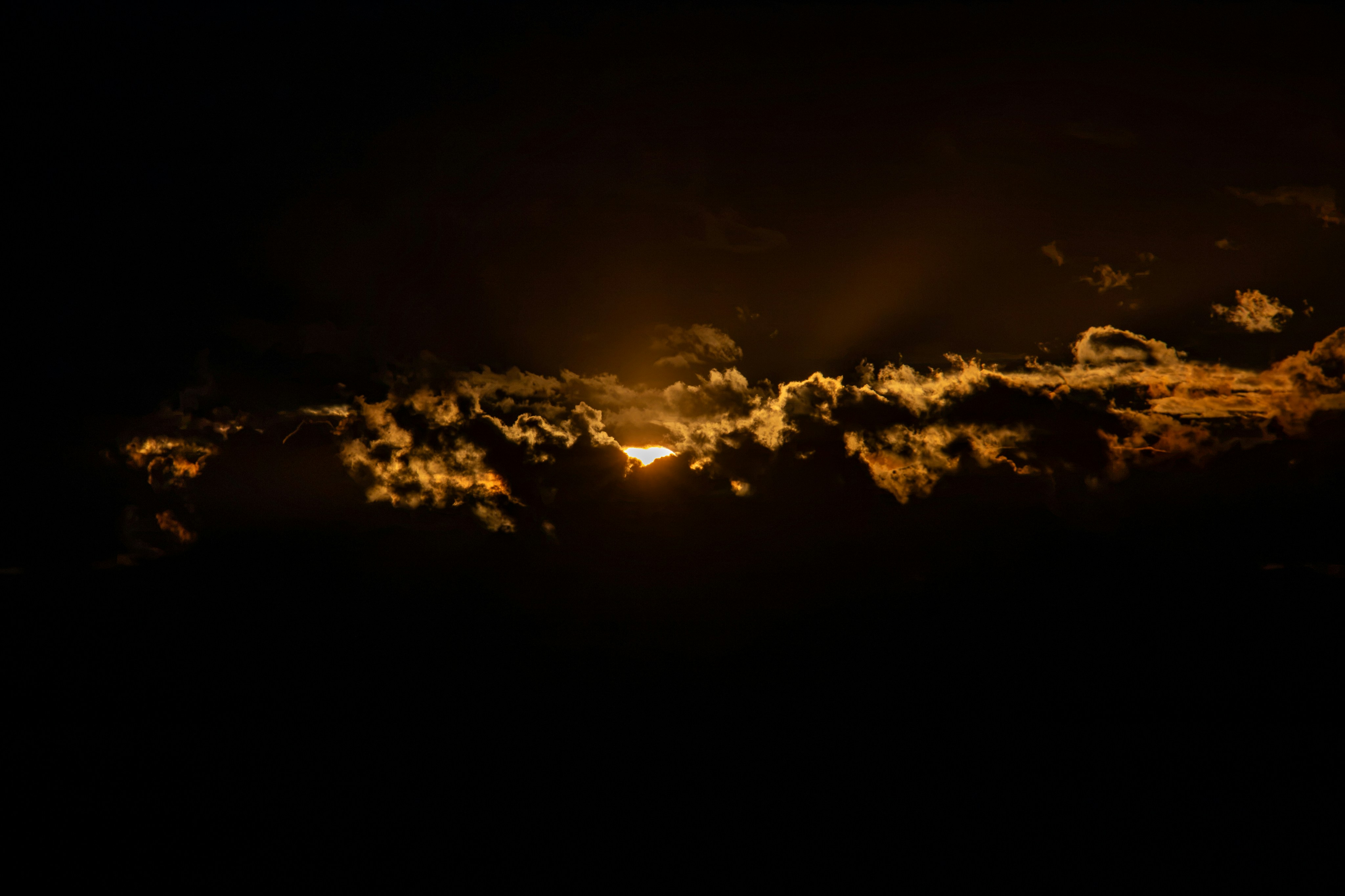 Sliver of Dawn Pierces the Dark Horizon
