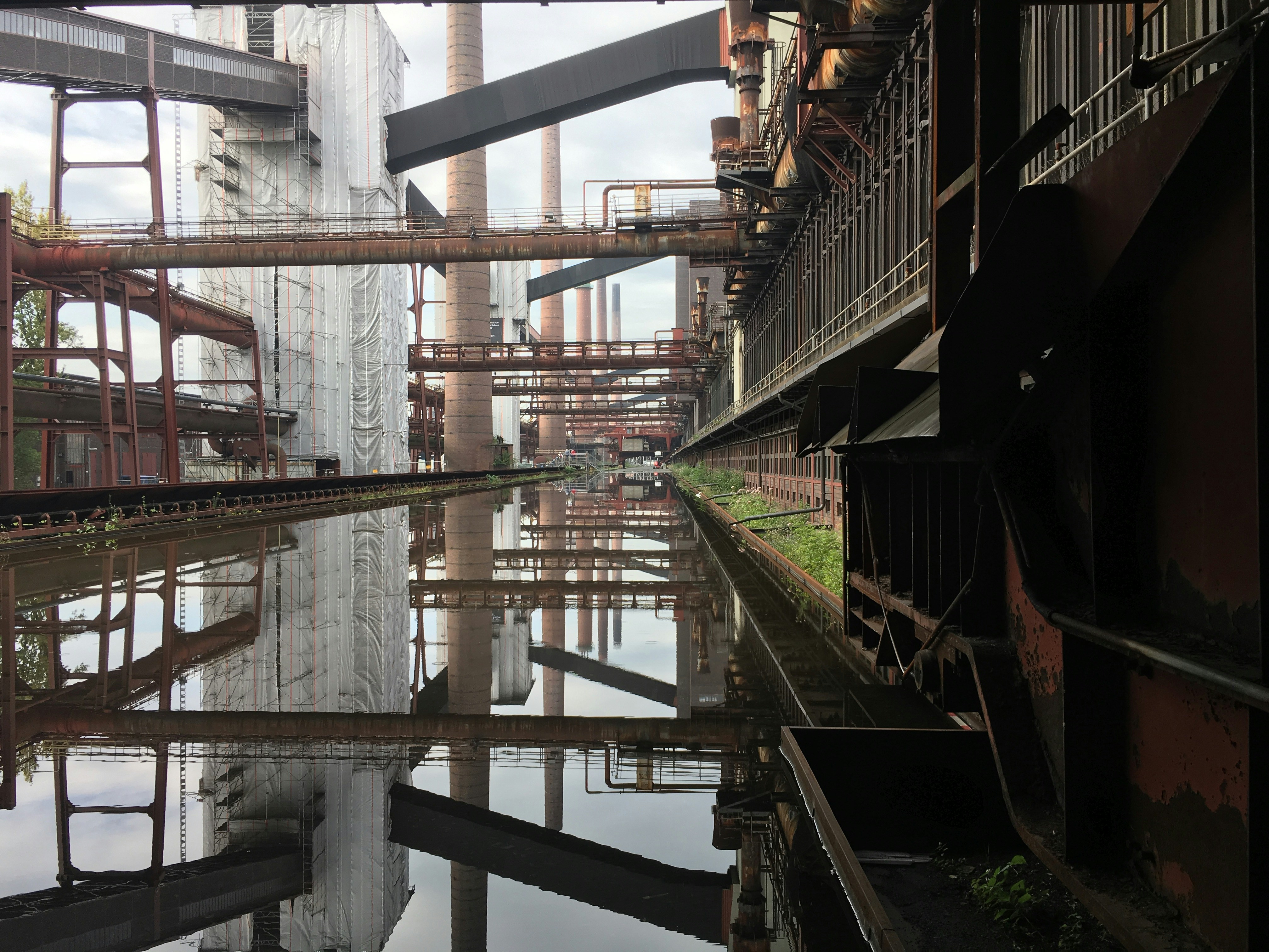 Industrial Reflections: A Symmetry of Pipes and Rails