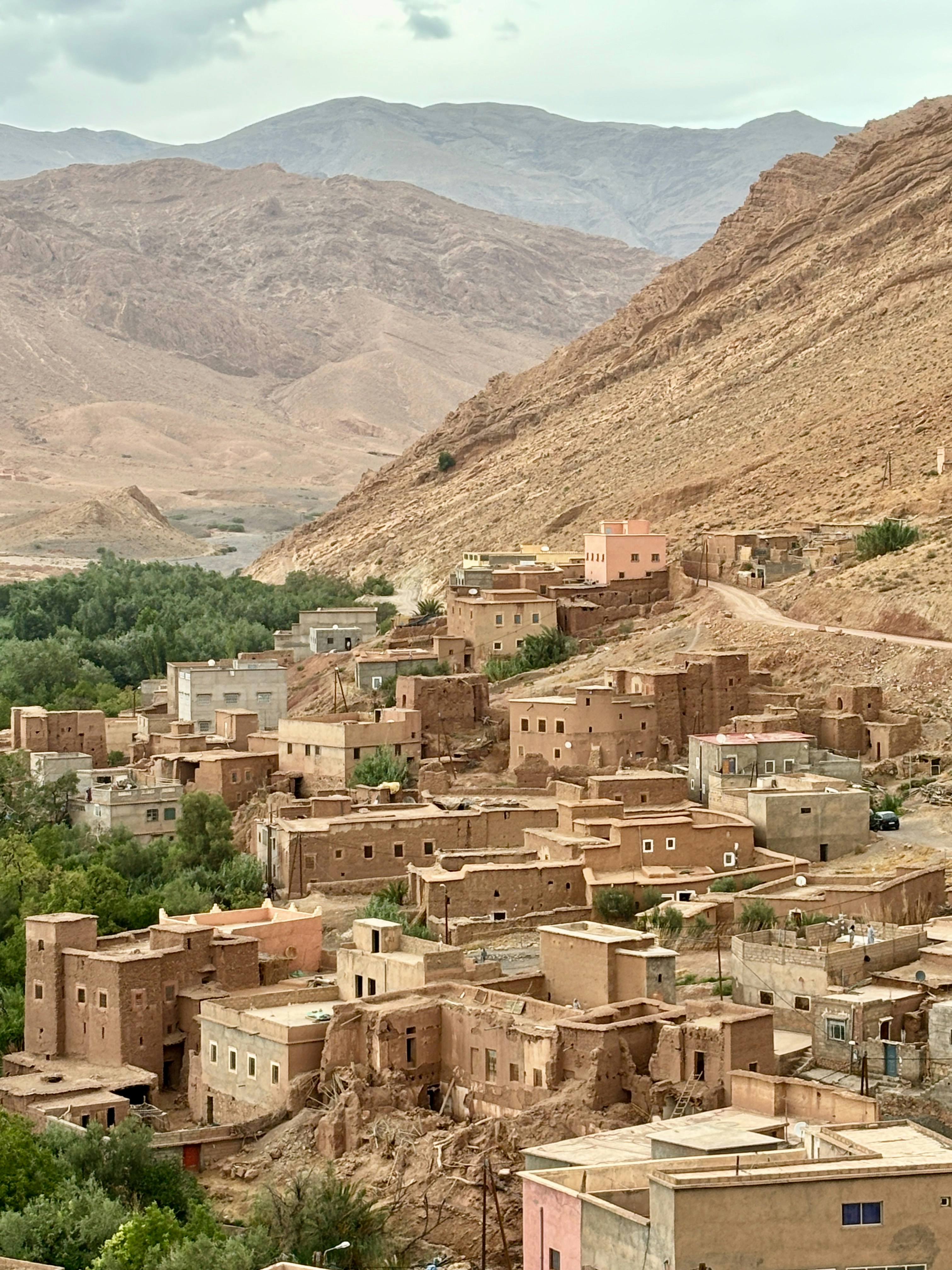 Desert Cliffside Village Nestled Along a Winding Road
