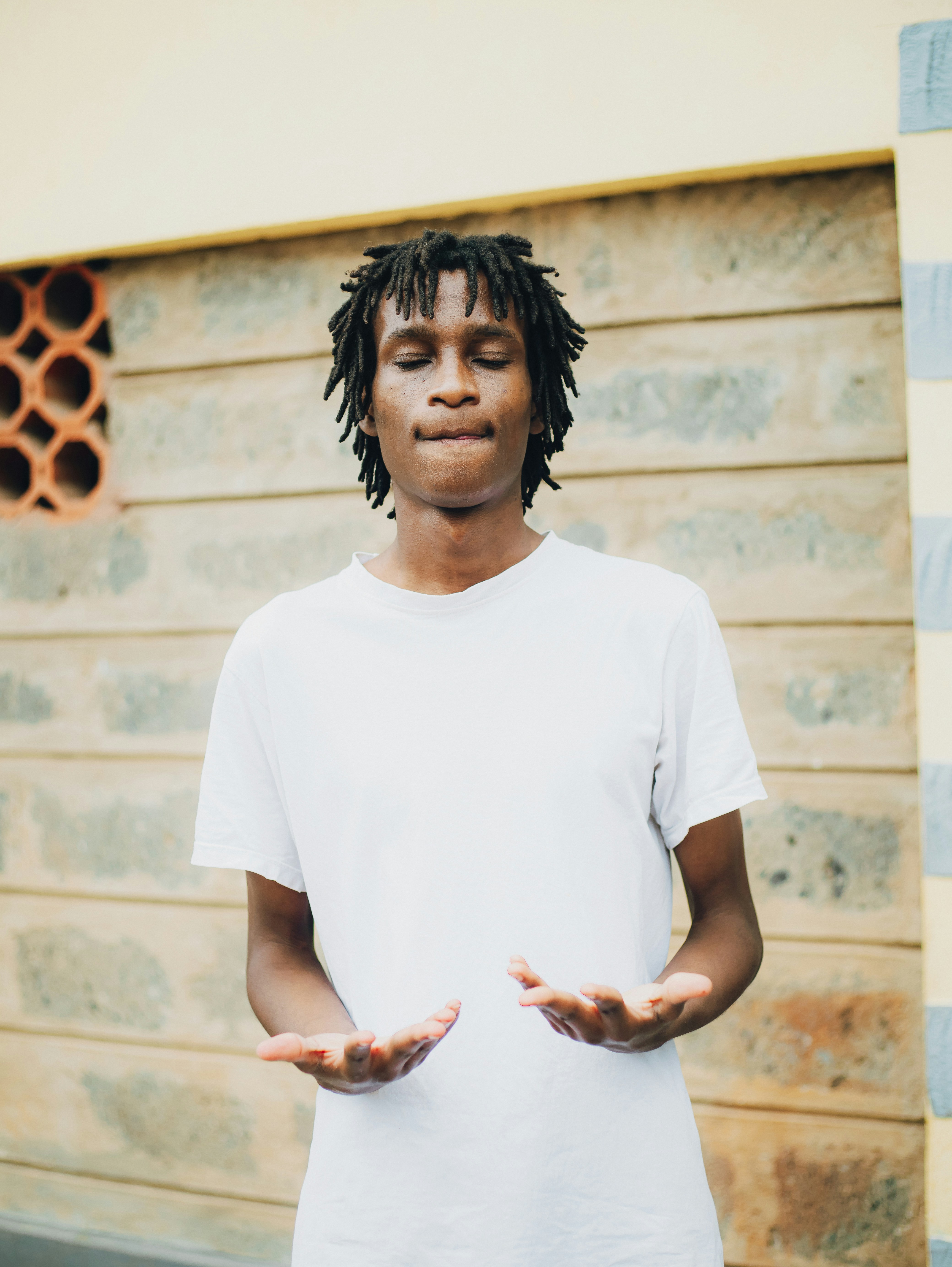 Calm Confidence: A Portrait of Stillness in White Tee
