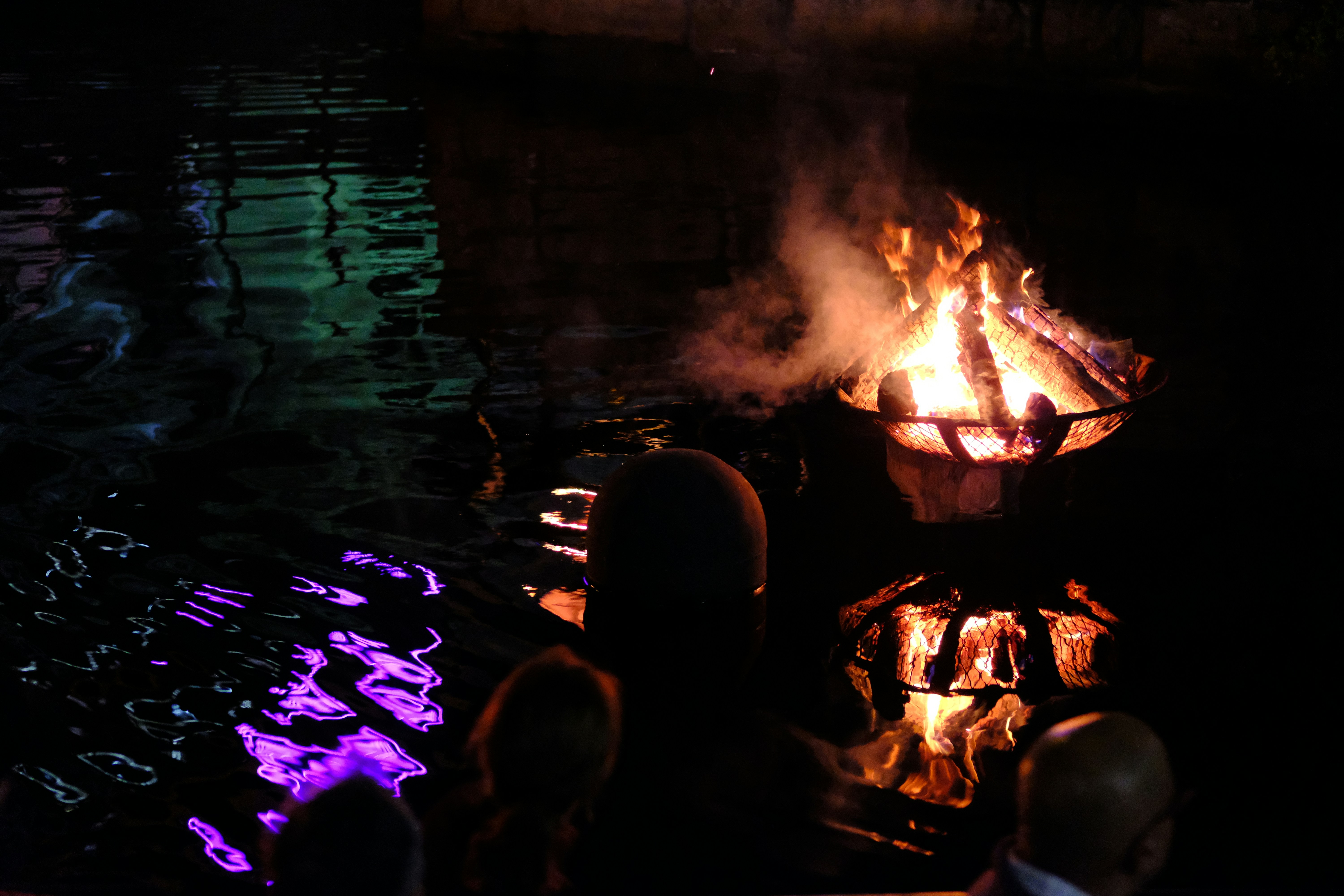 Firelight Circle: Faces in the Night Beneath Rising Flames